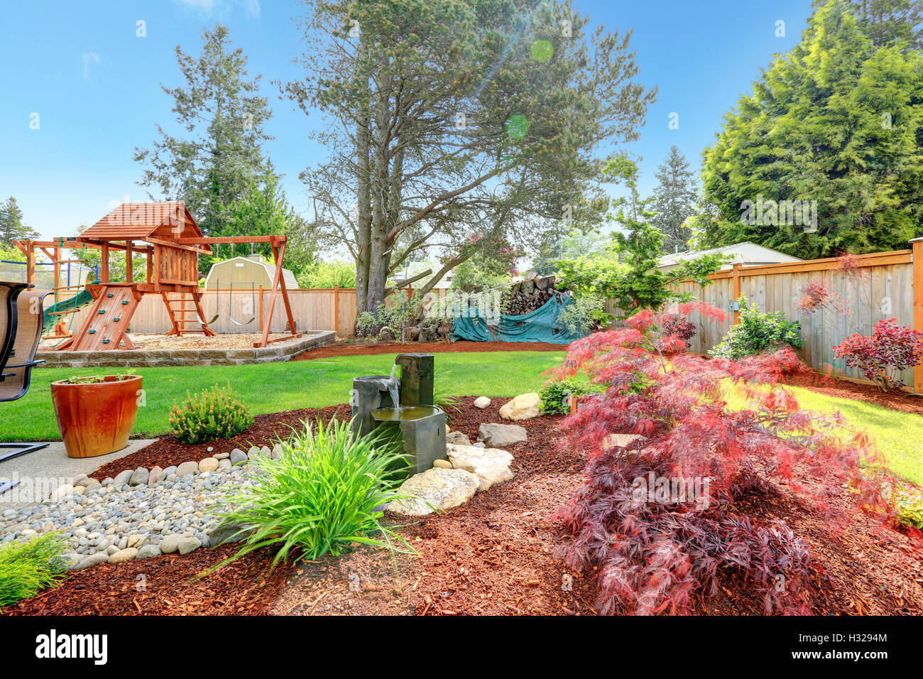 Flower bed design. Playground on the background Stock Photo - Alamy