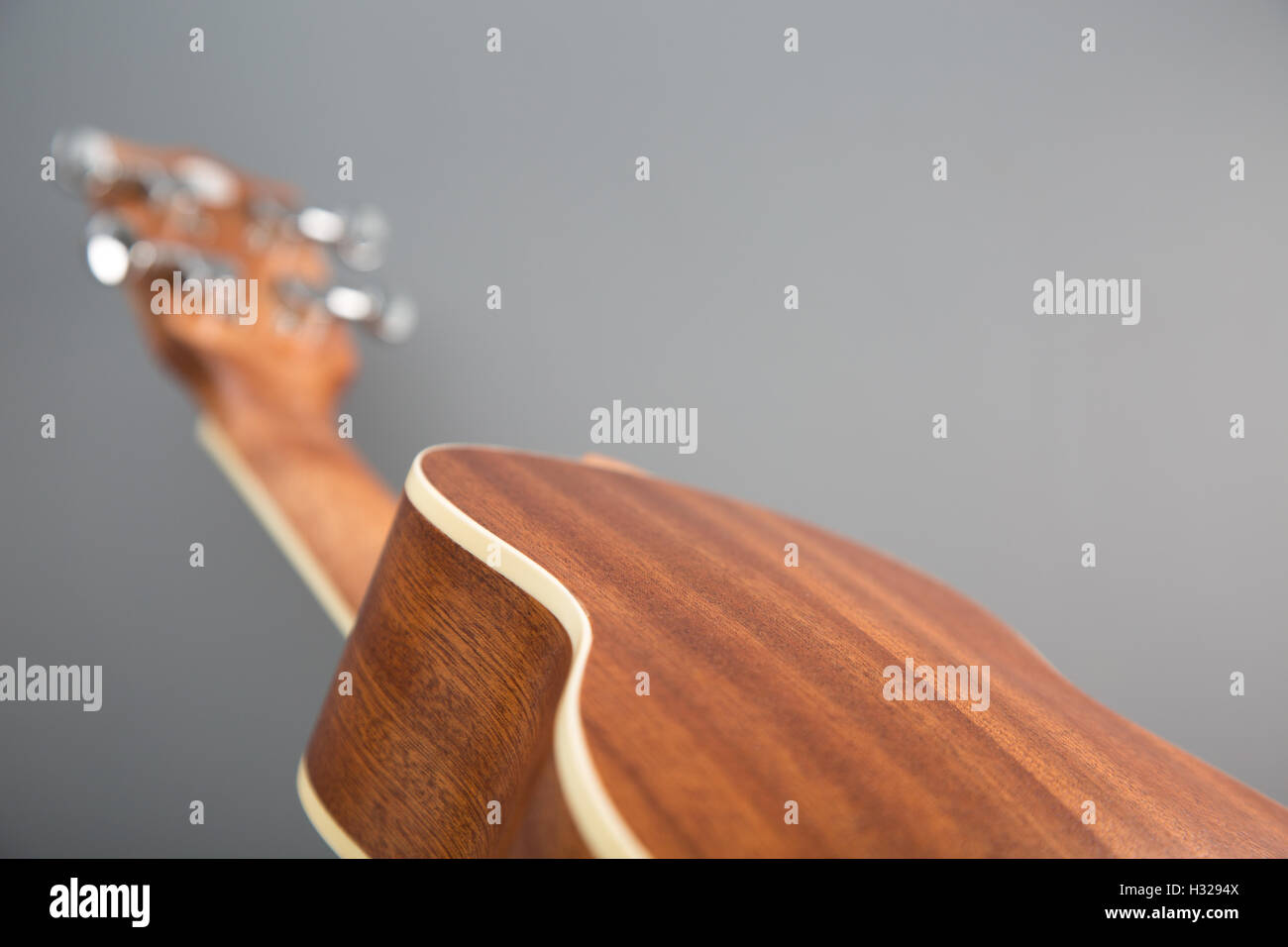 Close-up shot of classic ukulele guitar, back view Stock Photo - Alamy