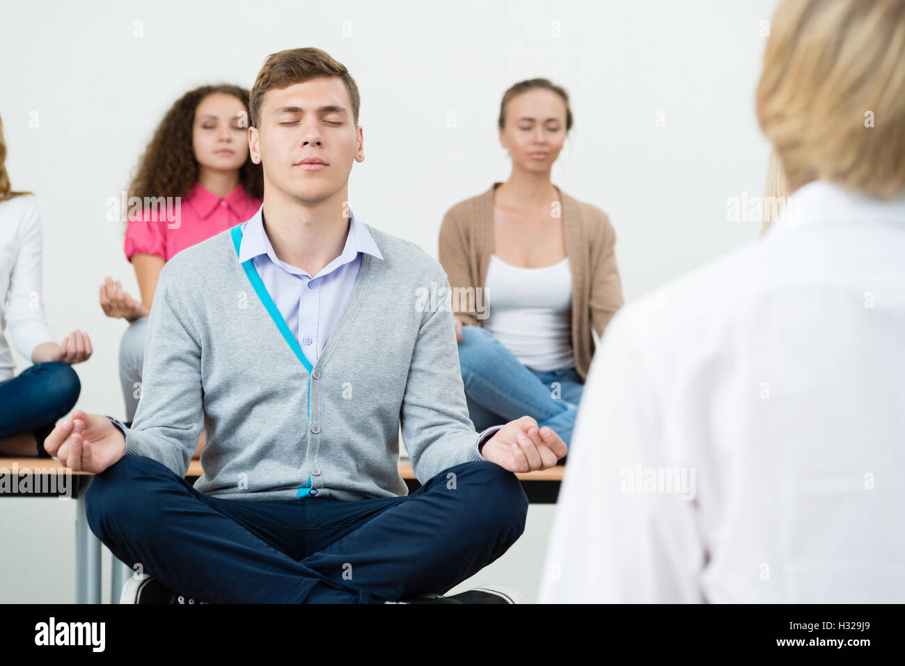 Young blond businesswoman meditating hi-res stock photography and ...