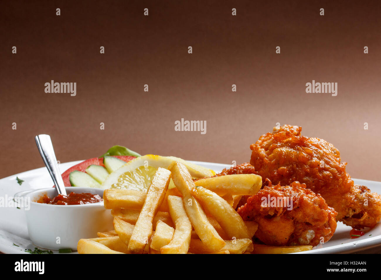 Spicy breaded chicken legs Stock Photo - Alamy