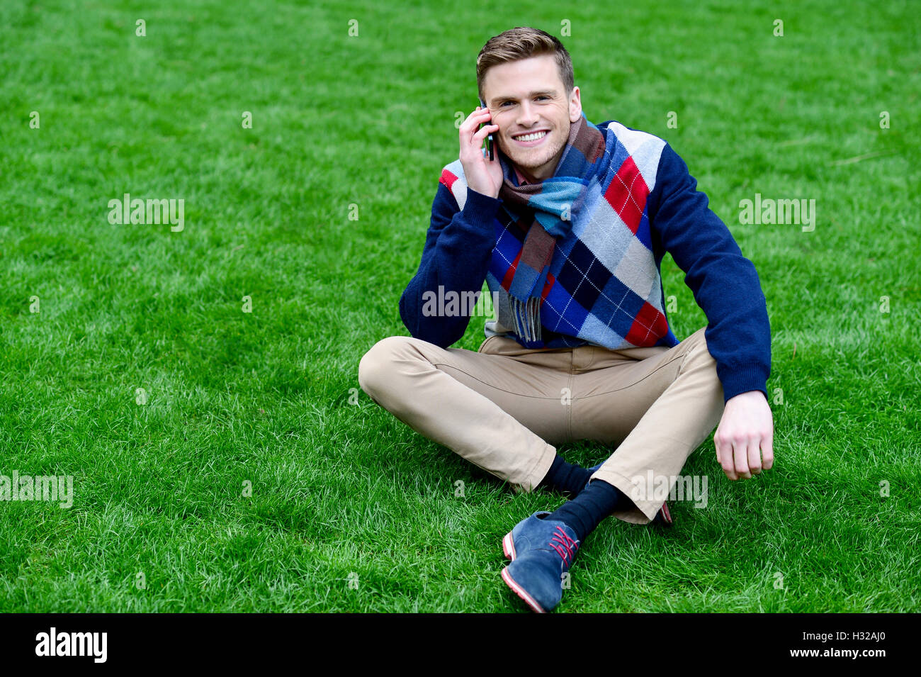 Happy young man communicating, posing outdoors Stock Photo - Alamy