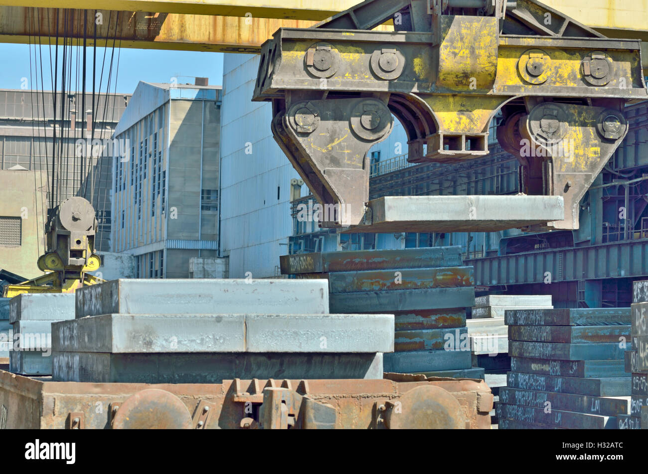 Container ship loading steel plates hi-res stock photography and images ...