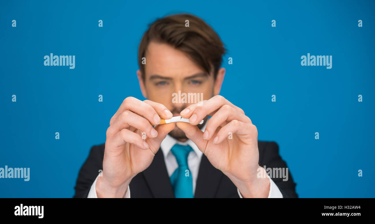 giving up smoking on blue Stock Photo - Alamy