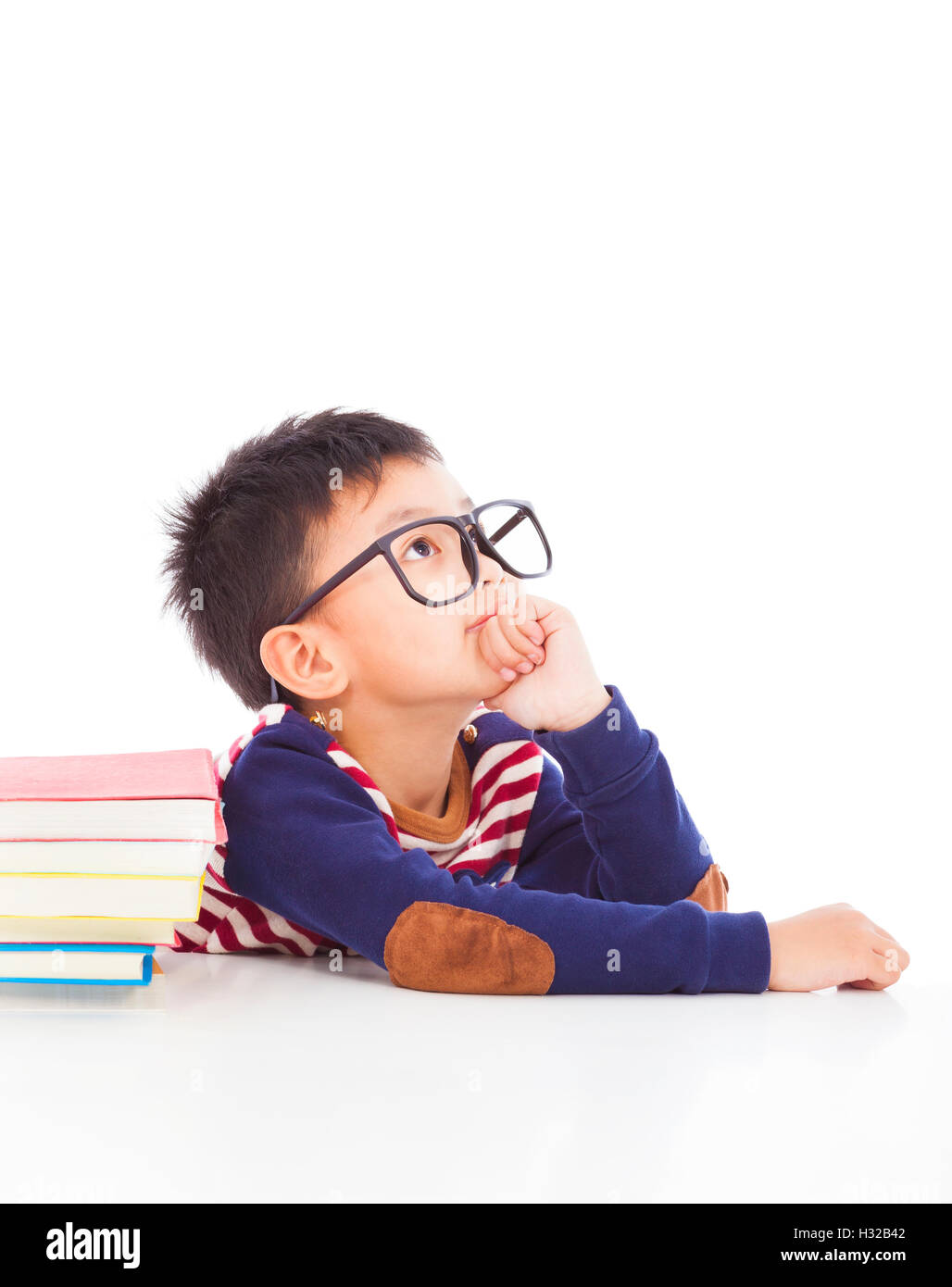 Boy pen thinking Cut Out Stock Images & Pictures - Alamy