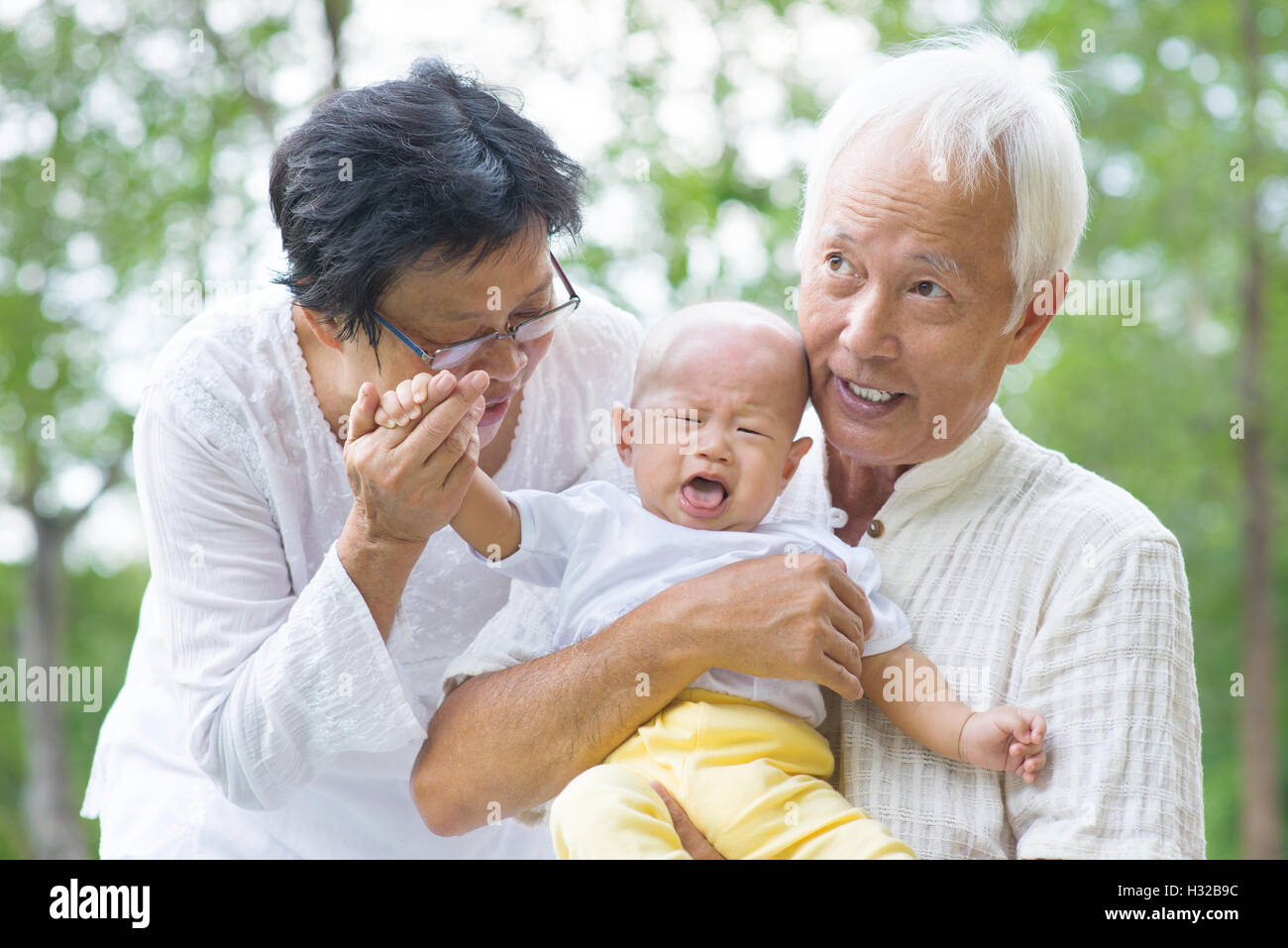 Asian grandparents playing grandchild hi-res stock photography and ...
