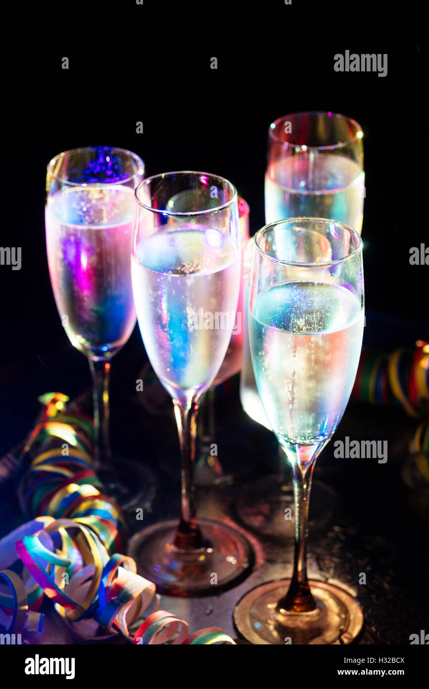 Champagne flutes at a party at night Stock Photo - Alamy