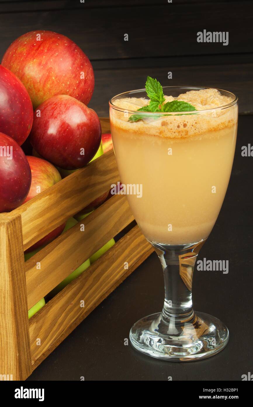 Fresh pressed apple juice unfiltered. Apple juice and apples on wooden ...