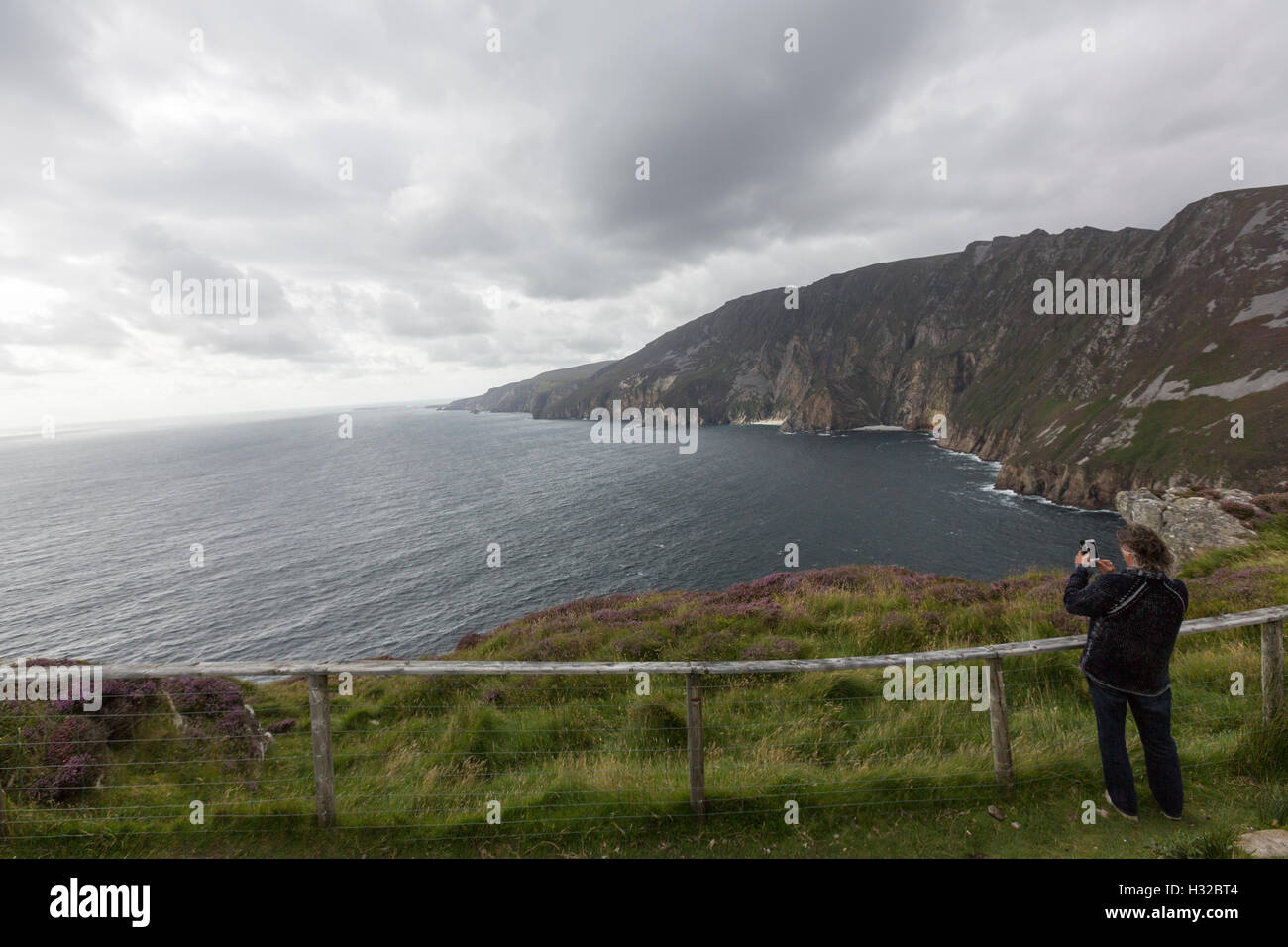 Tourist taking pictures at Slieve League, County Donegal, Ireland Stock ...