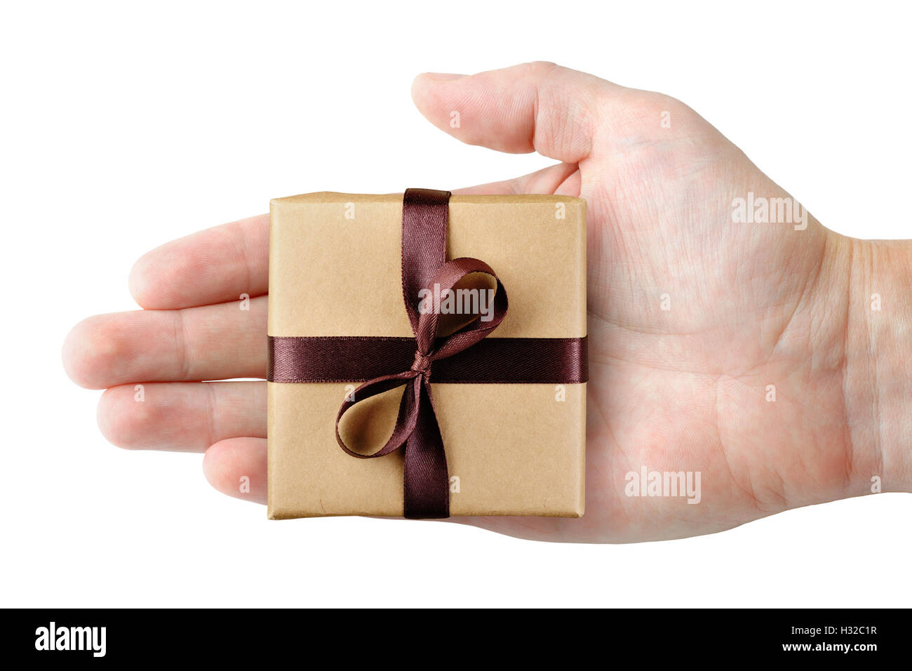 Gift box in hand top view isolated on white background Stock Photo - Alamy