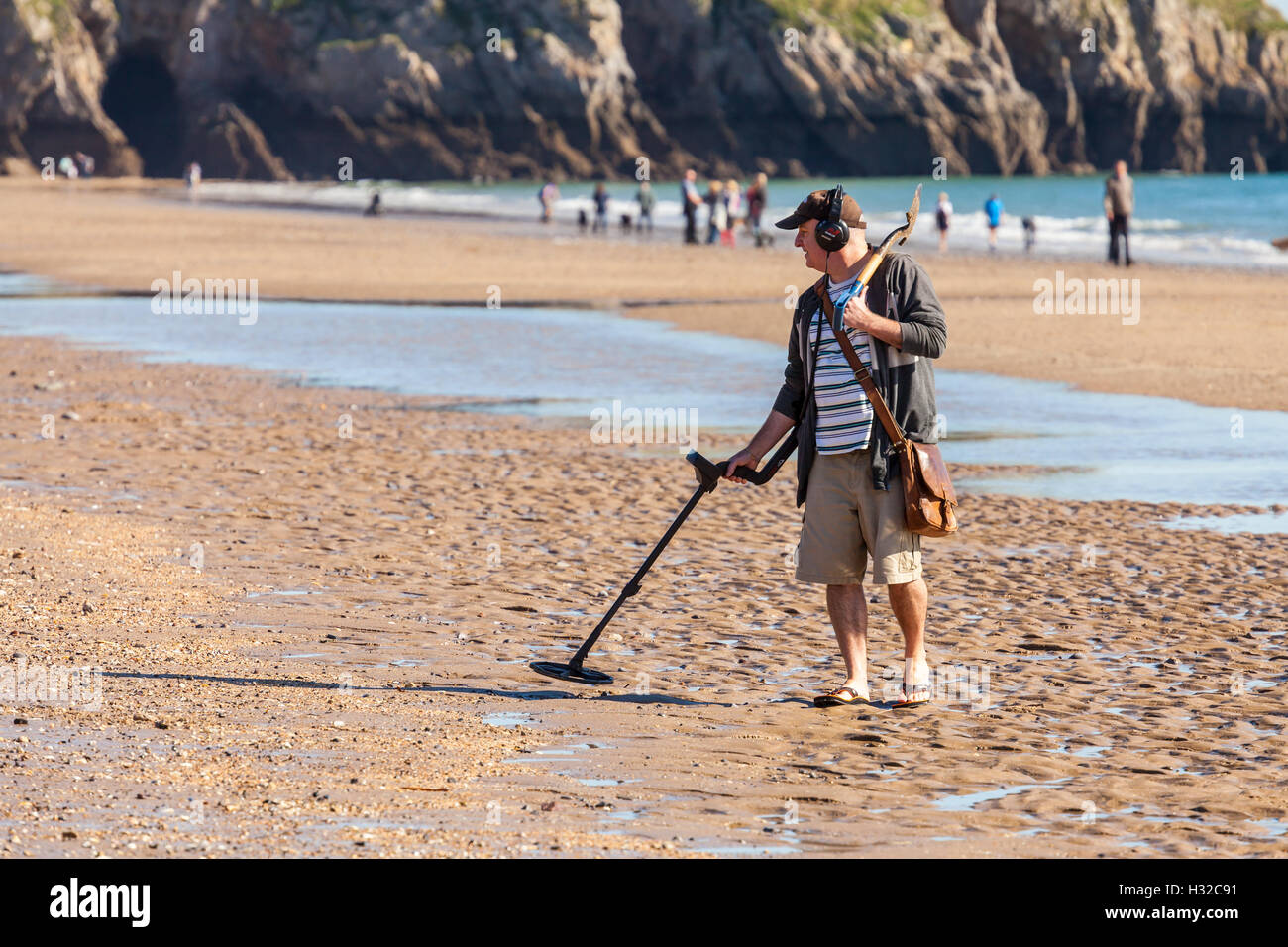 Man sweeping beach hi-res stock photography and images - Alamy