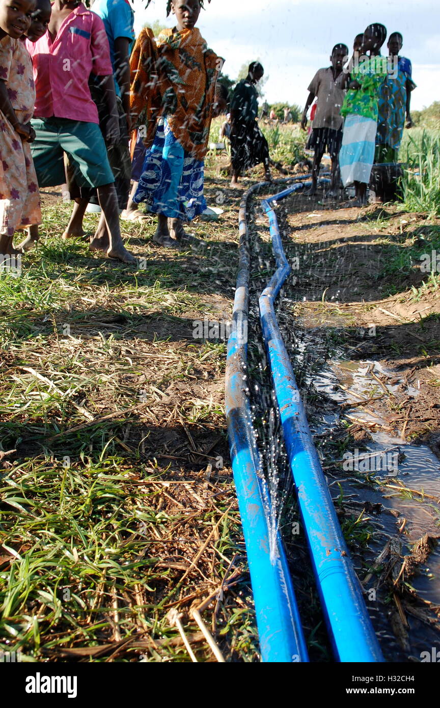 Pipes carry water to African villagers. Malawi Stock Photo - Alamy