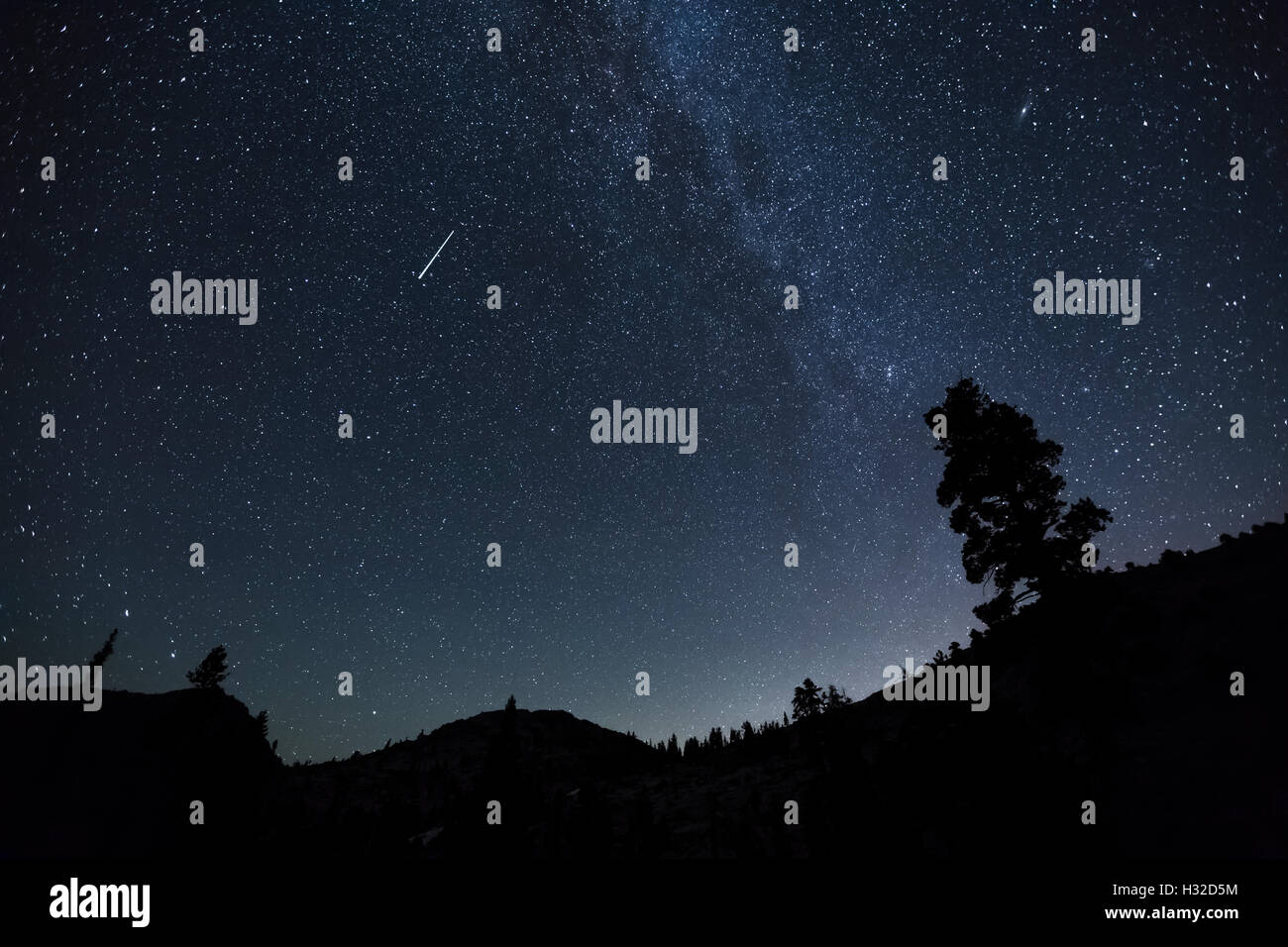 Meteor crossing night sky during Perseid Meteor Shower, viewed from ...