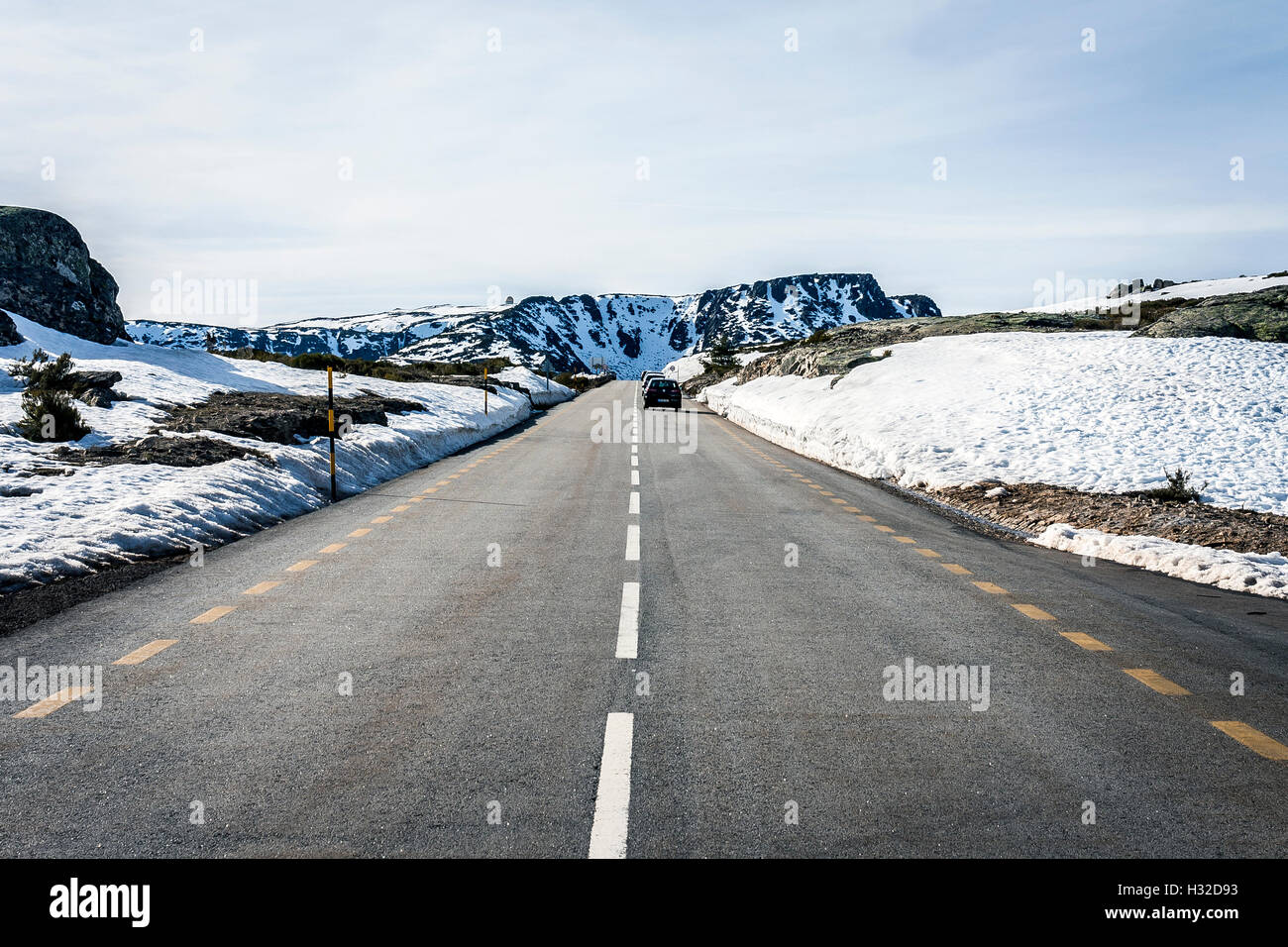Road in snowy landscape Stock Photo - Alamy