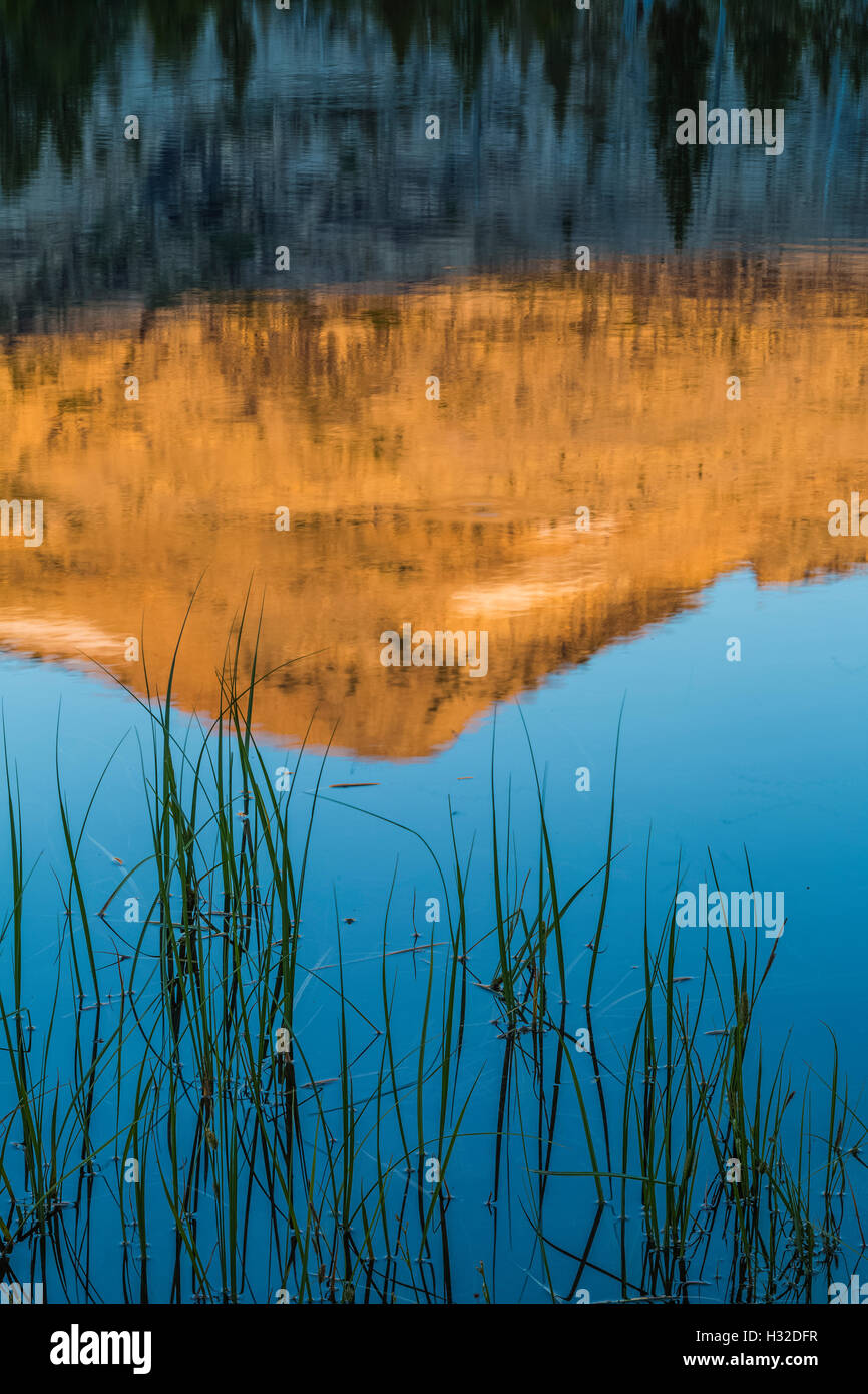 Morning light on Ropi Lake, with Pyramid Peak reflected on the surface ...