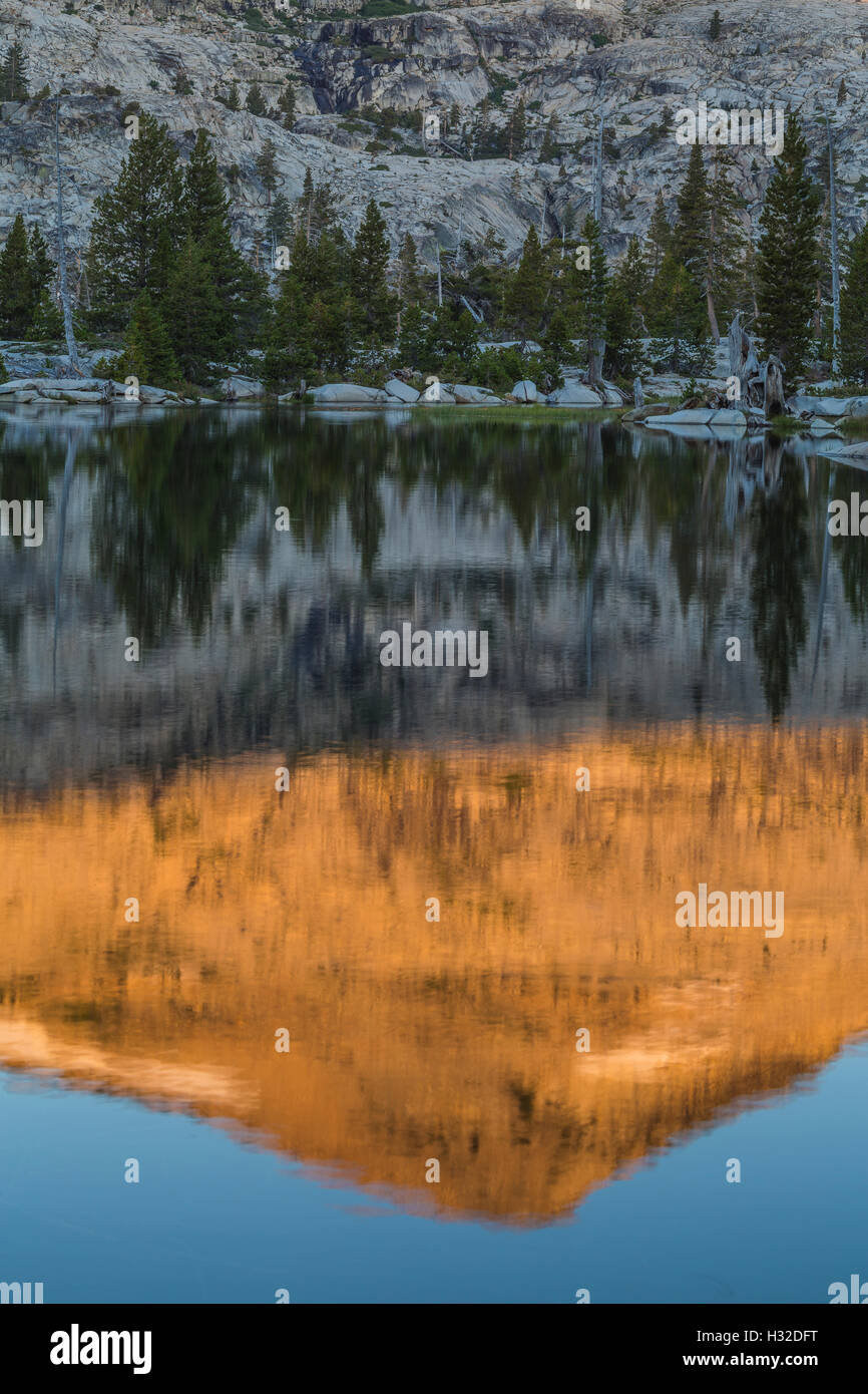 Morning light on Ropi Lake, with Pyramid Peak reflected on the surface ...