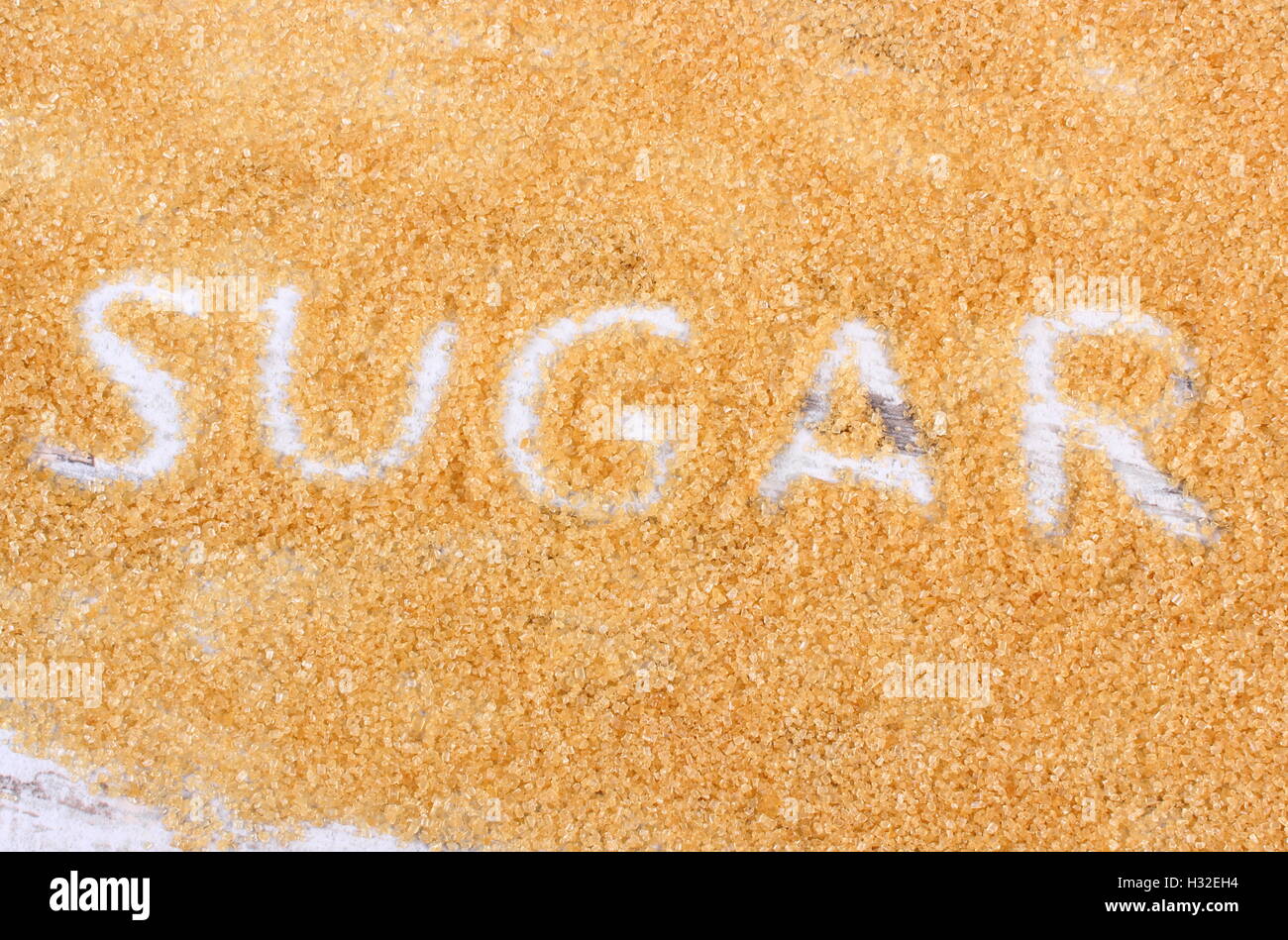Word sugar written in granulated natural brown cane sugar Stock Photo ...