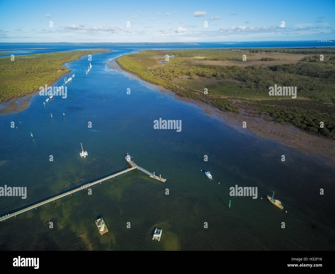 Aerial view of Warneet pier, mangroves, and ocean inlet. Melbourne ...