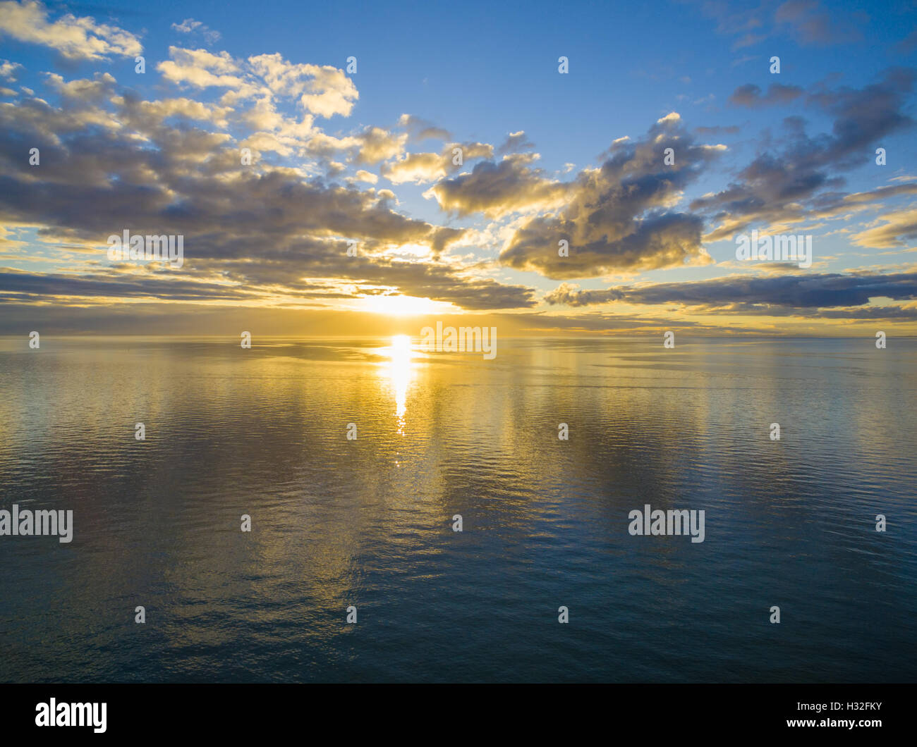 Golden sunset over water aerial Stock Photo - Alamy