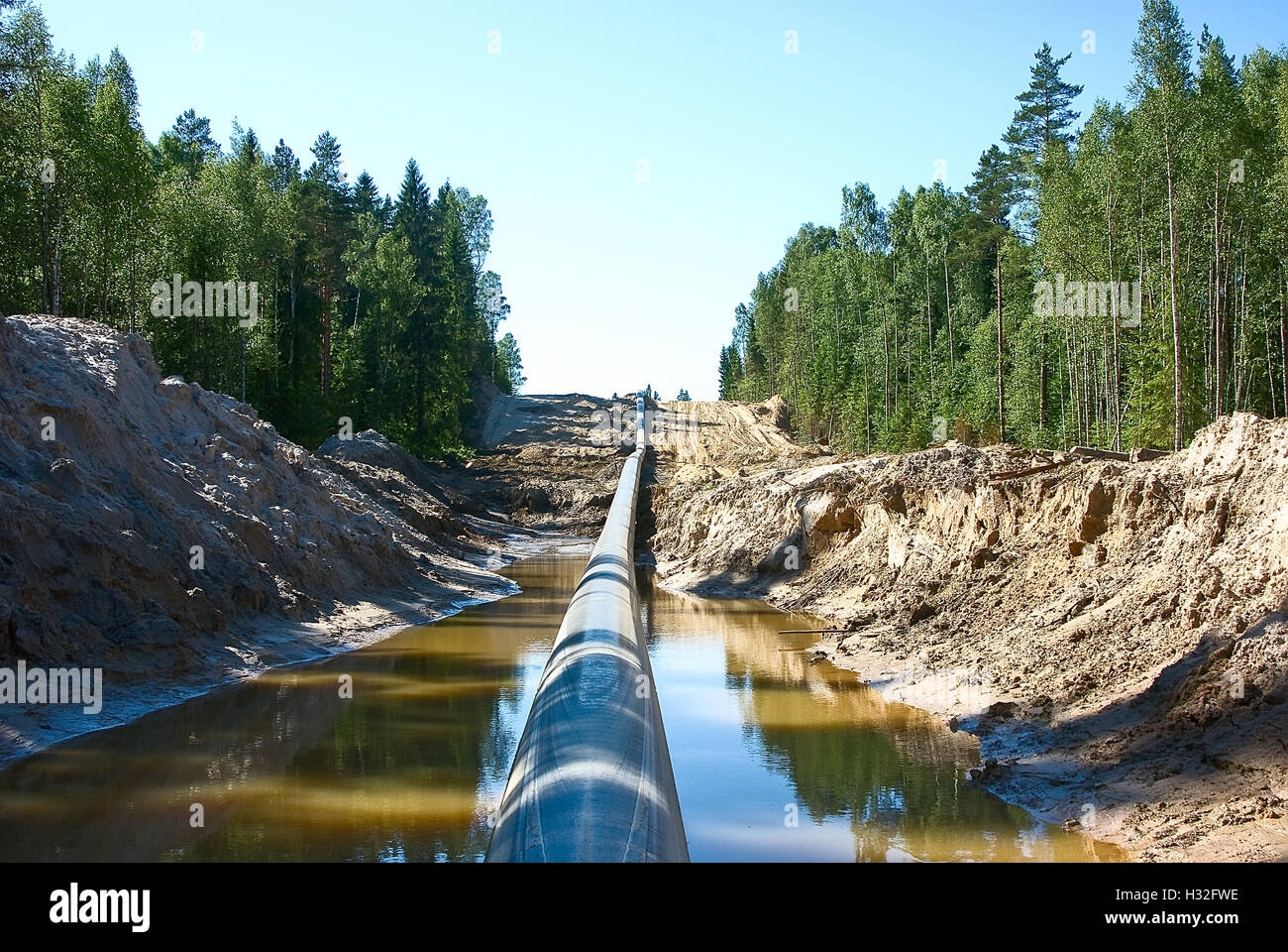 Lining of the long pipeline on a countryside Stock Photo - Alamy