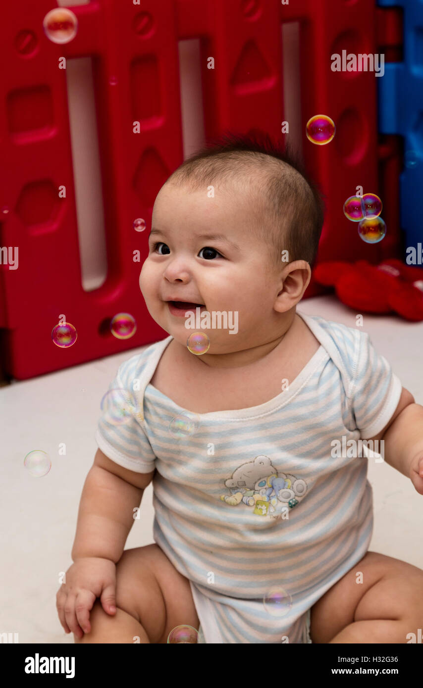 baby laughing at bubbles Stock Photo - Alamy