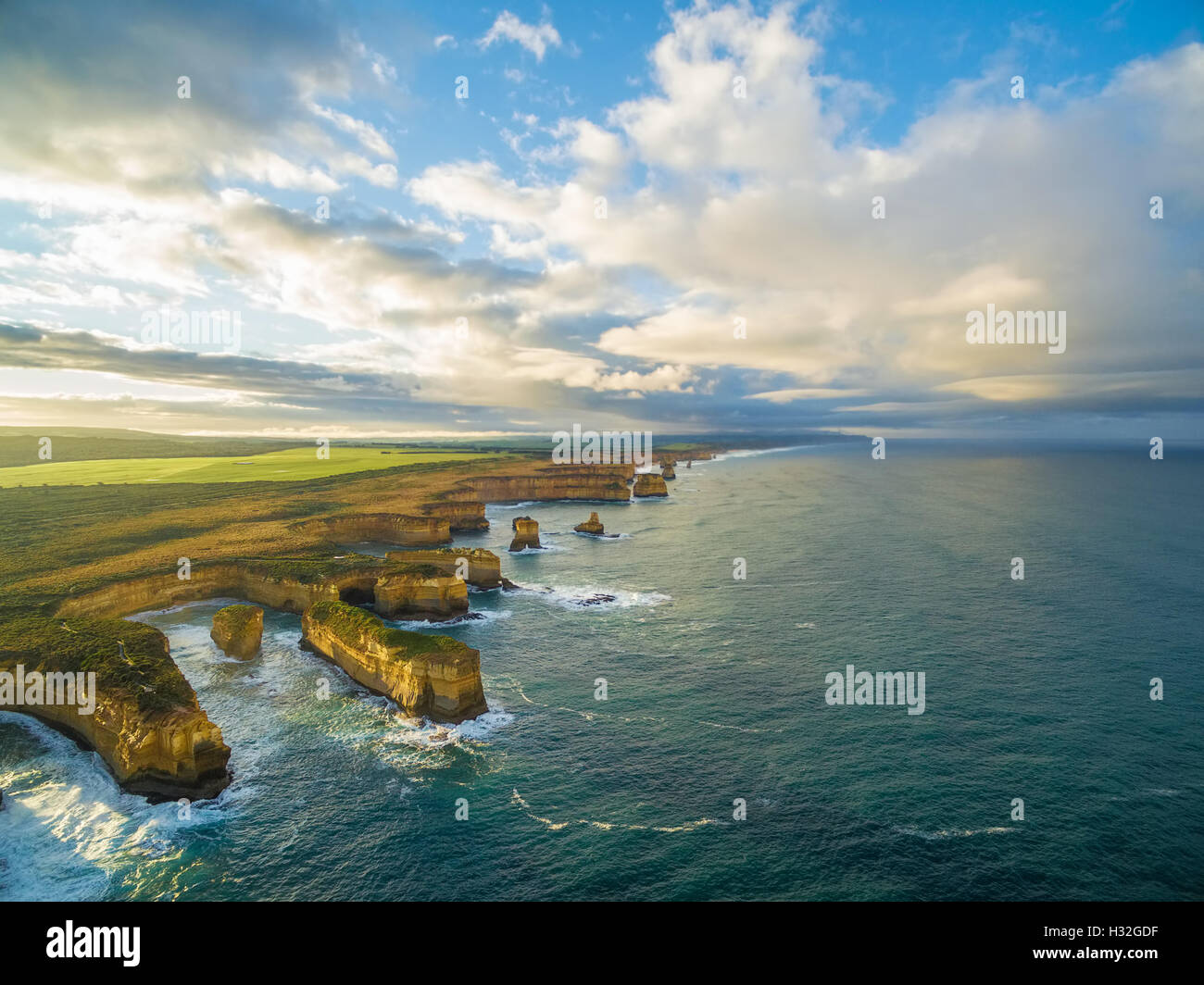 Aerial view of the Island Archway and rugged coastline at sunrise ...