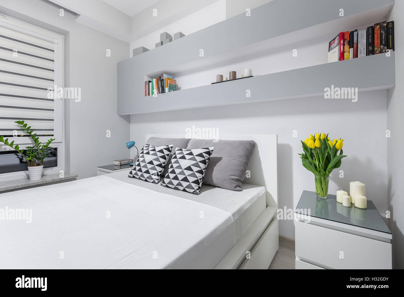 New design light bedroom with large bed, window and side table Stock ...