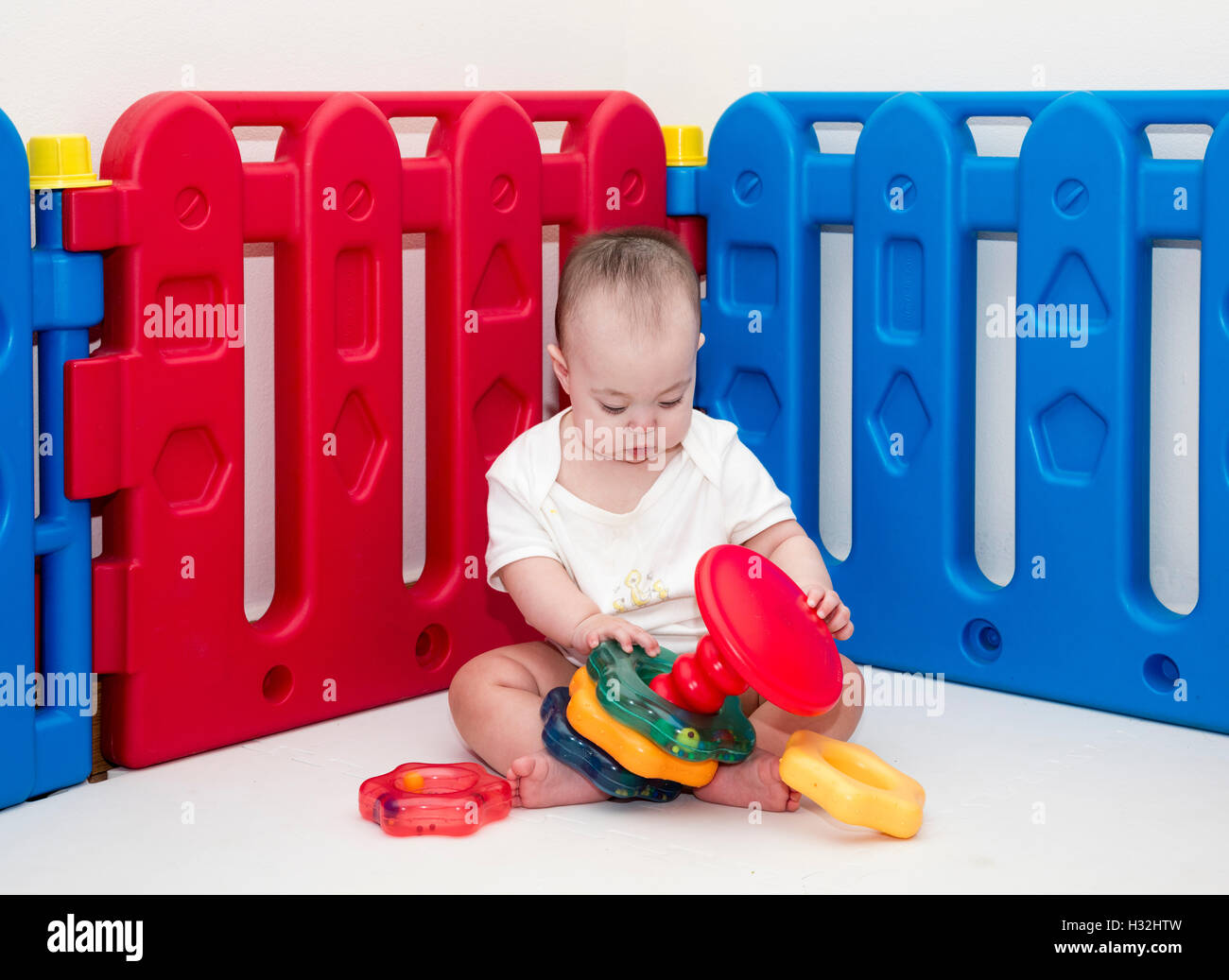 baby playing with stacking ring toy Stock Photo - Alamy