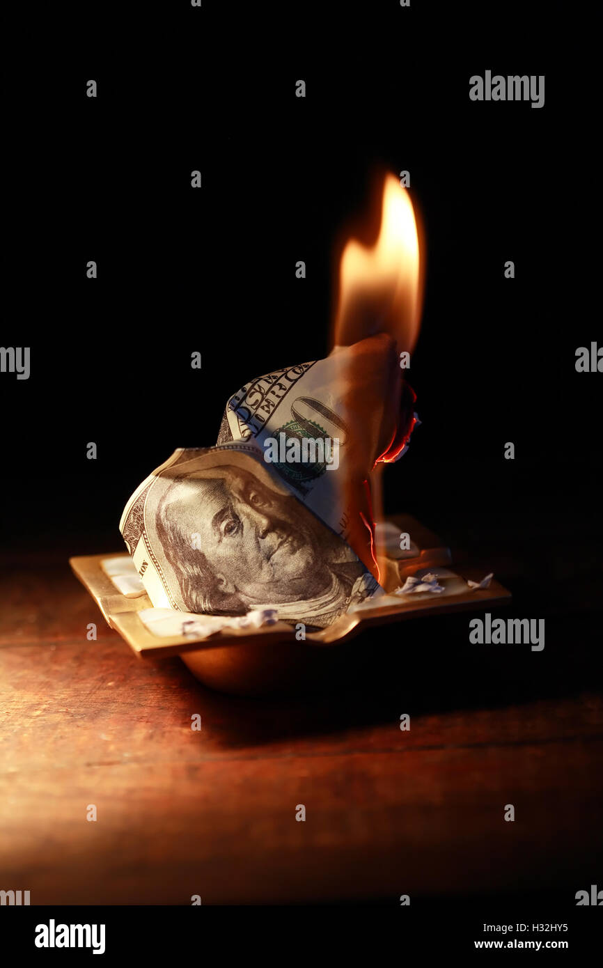 Burning one hundred dollar bill hi-res stock photography and images - Alamy