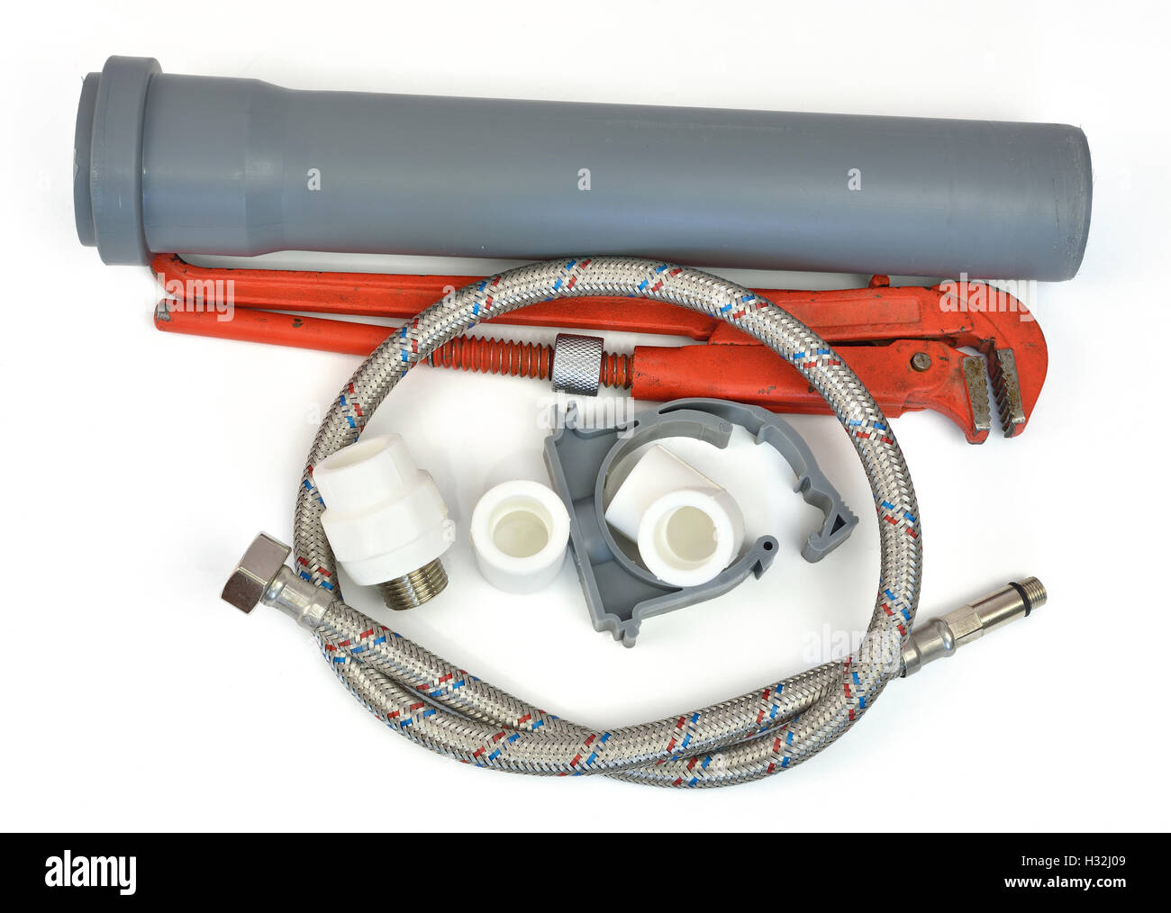 Pipe wrench and plumbing parts Stock Photo - Alamy