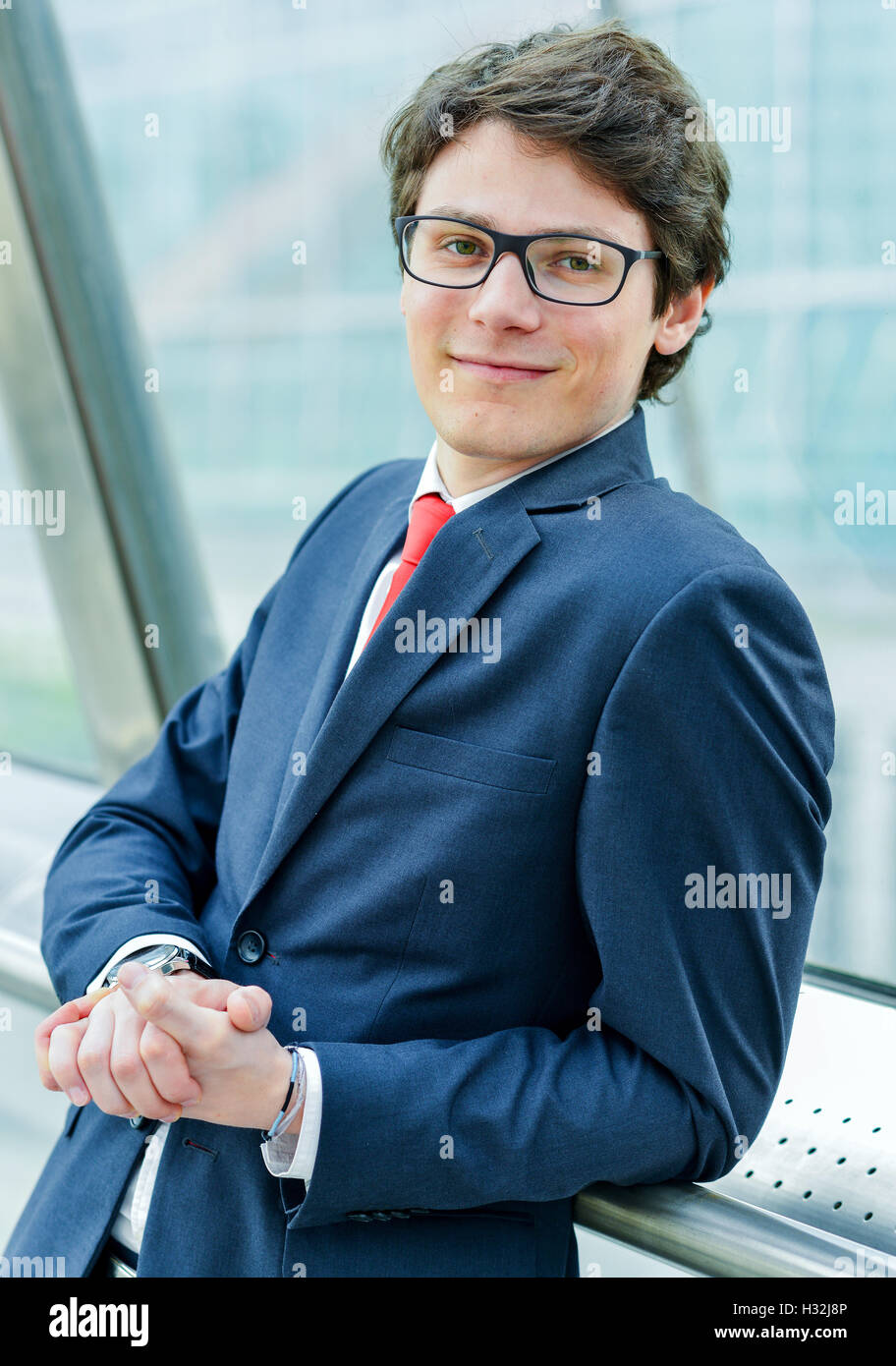 Outdoor portrait of a dynamic junior executive smiling Stock Photo - Alamy