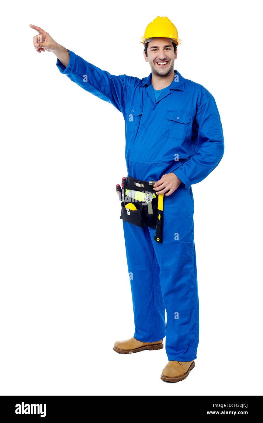 Happy male worker pointing at something Stock Photo - Alamy