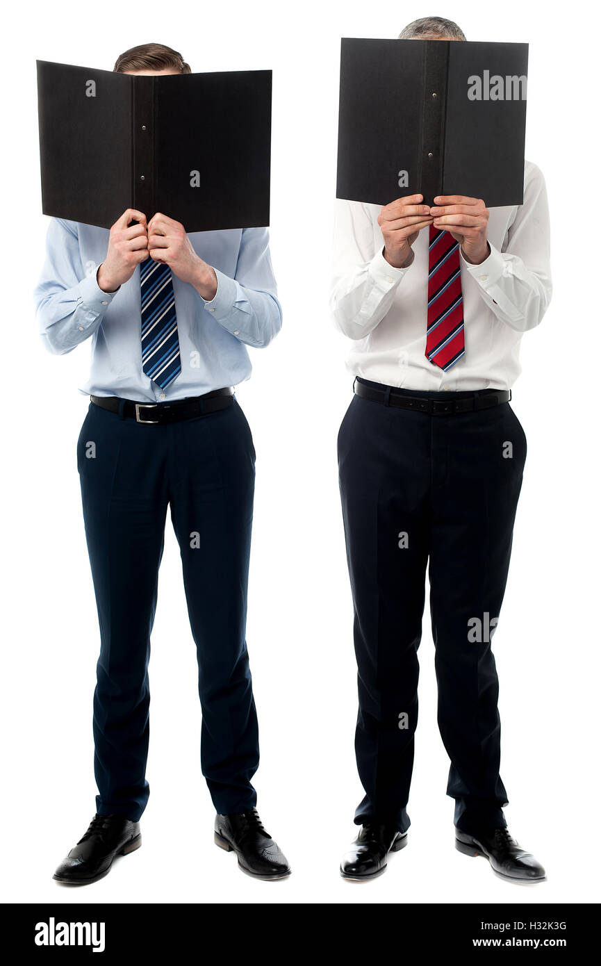 Business people reading documents Cut Out Stock Images & Pictures - Alamy