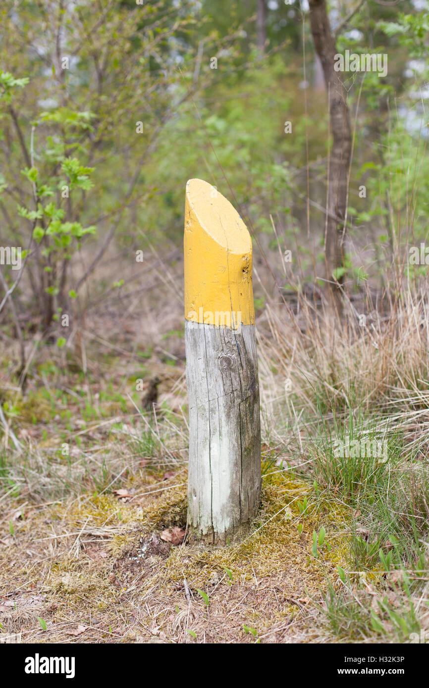Yellow marking at a walking path Stock Photo - Alamy