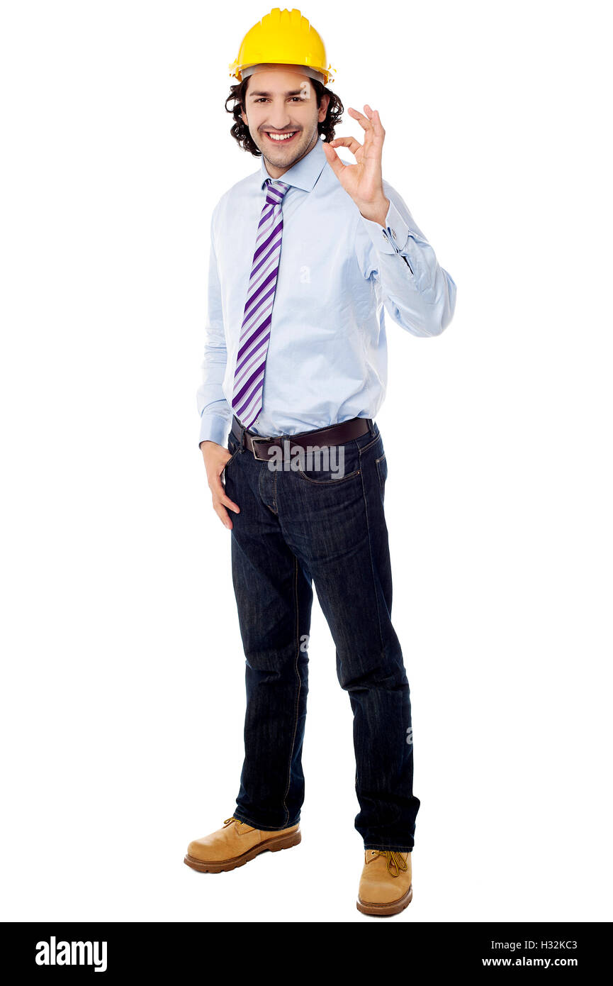 Full length image of engineer with ok sign Stock Photo - Alamy