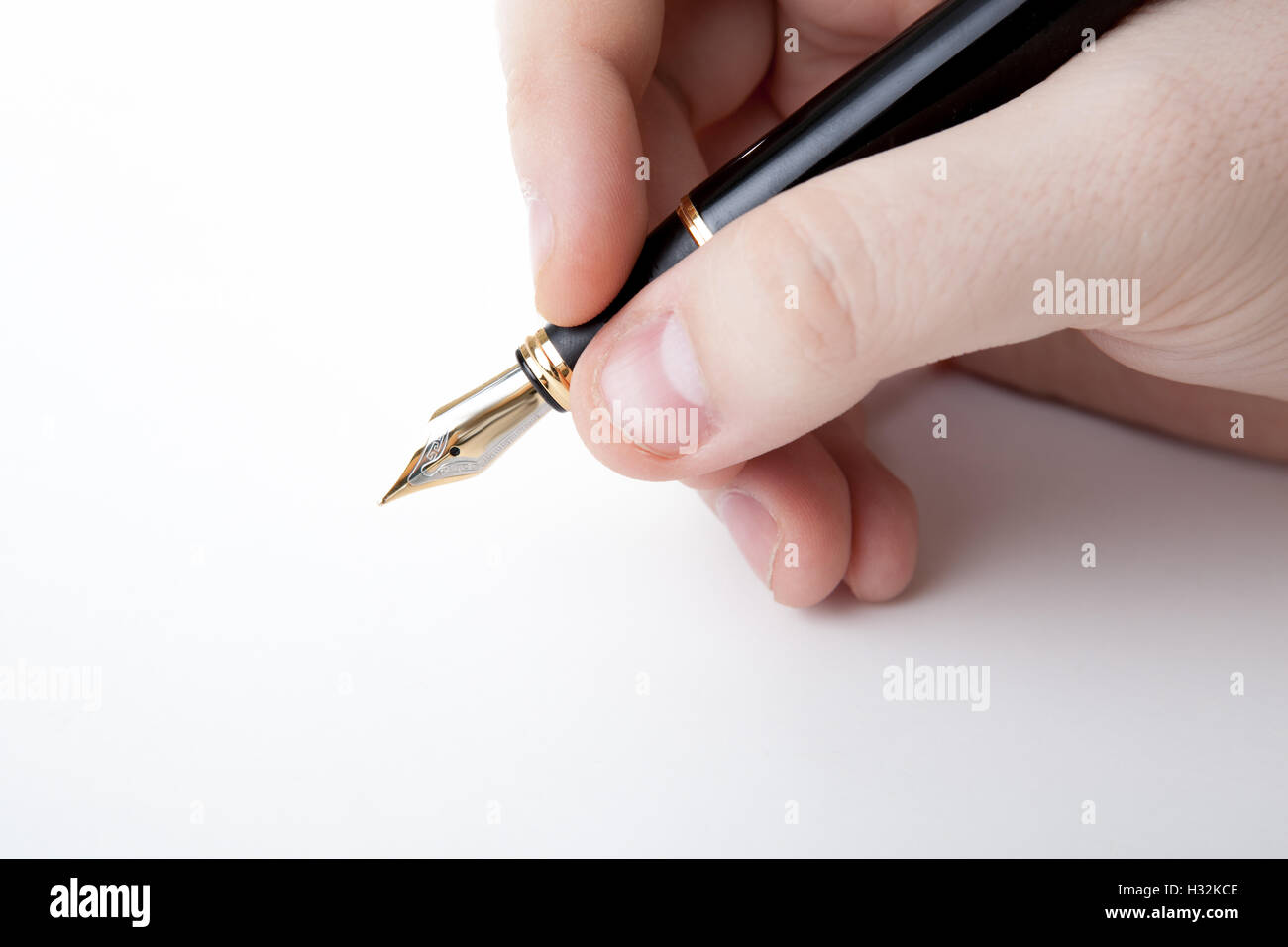 pen in the man's hand to signature Stock Photo - Alamy