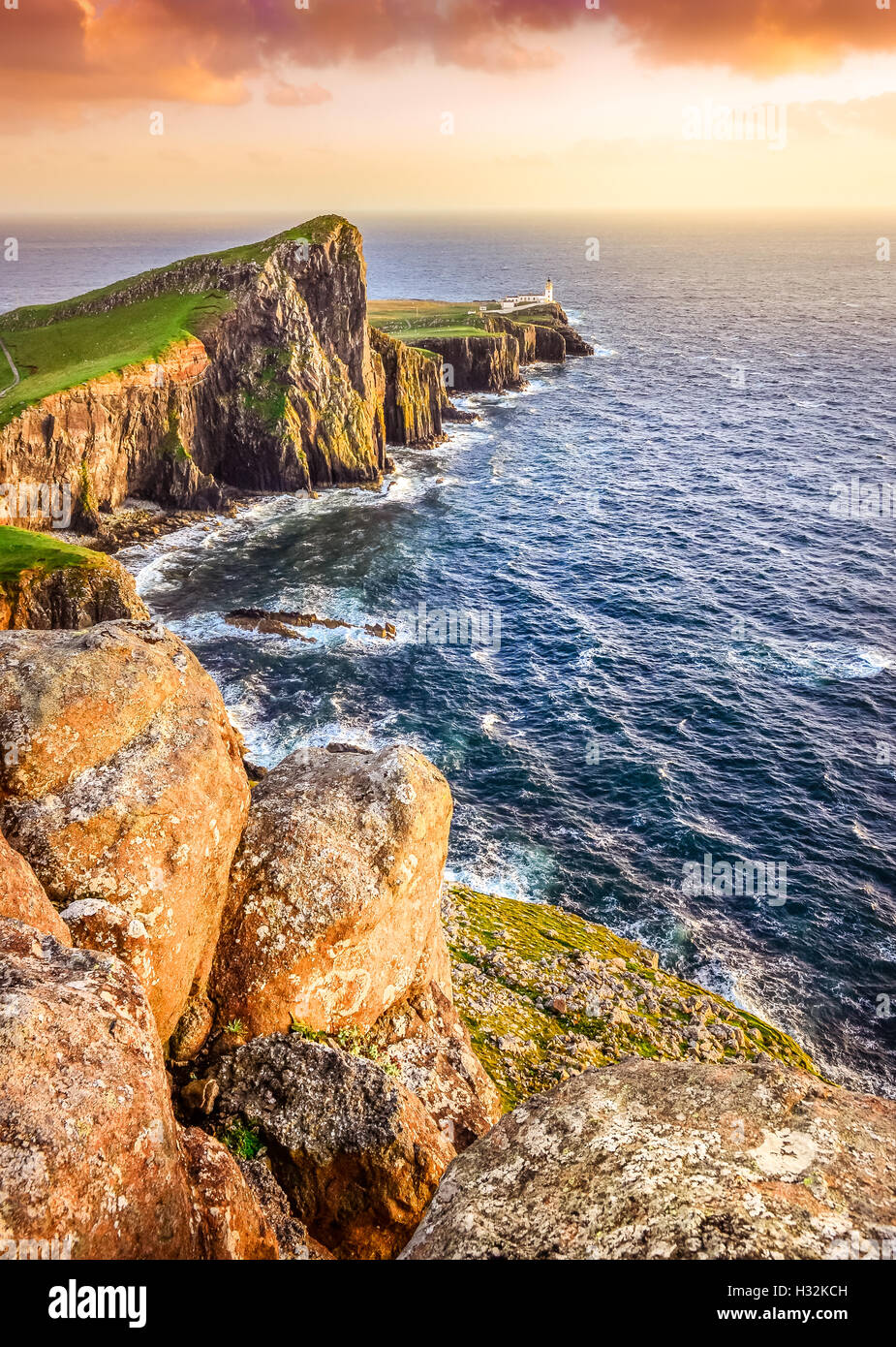 Vertical view of Neist Point lighthouse with rocks foreground, S Stock ...