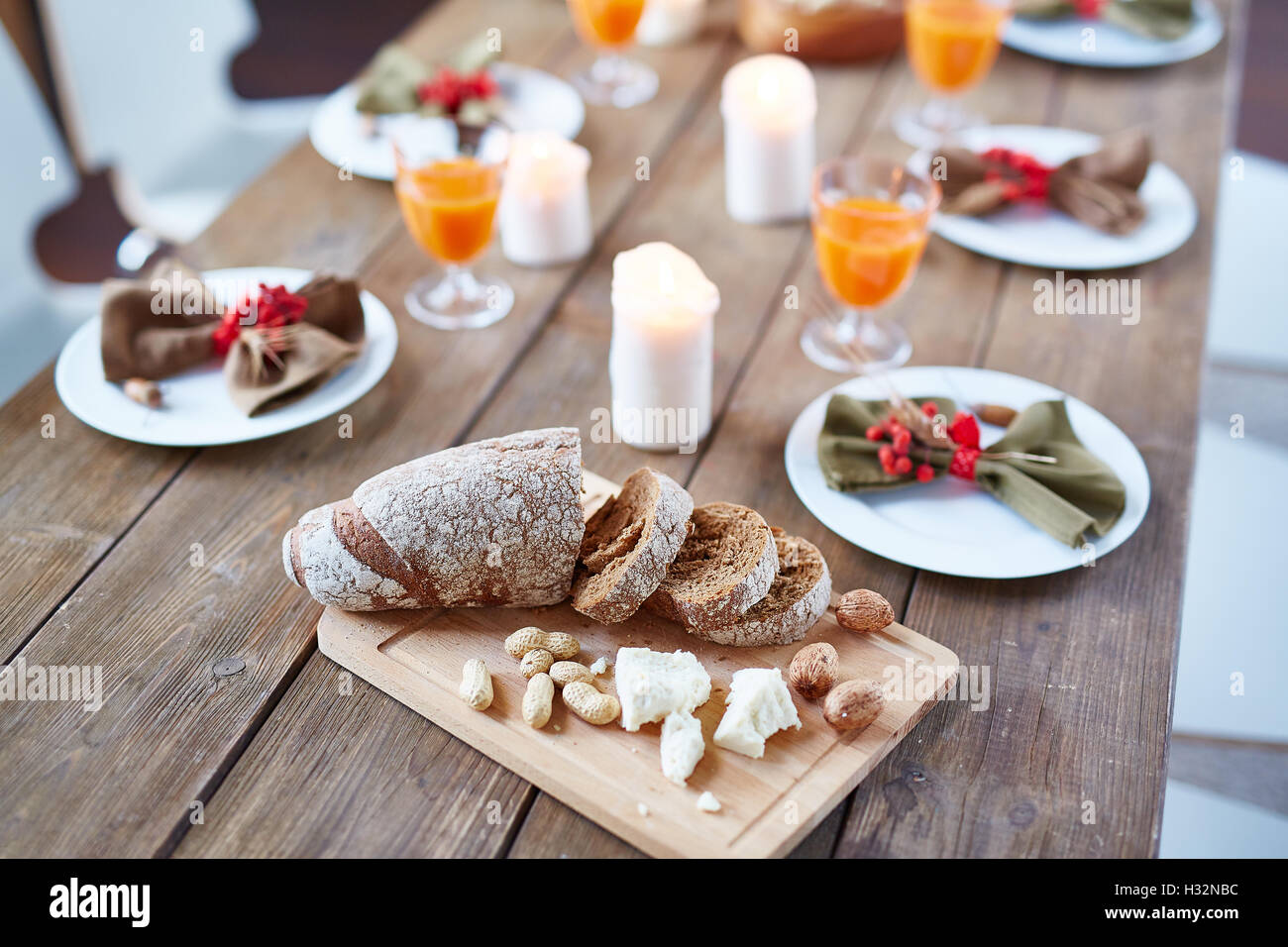 Rustic table with bread Stock Photo - Alamy