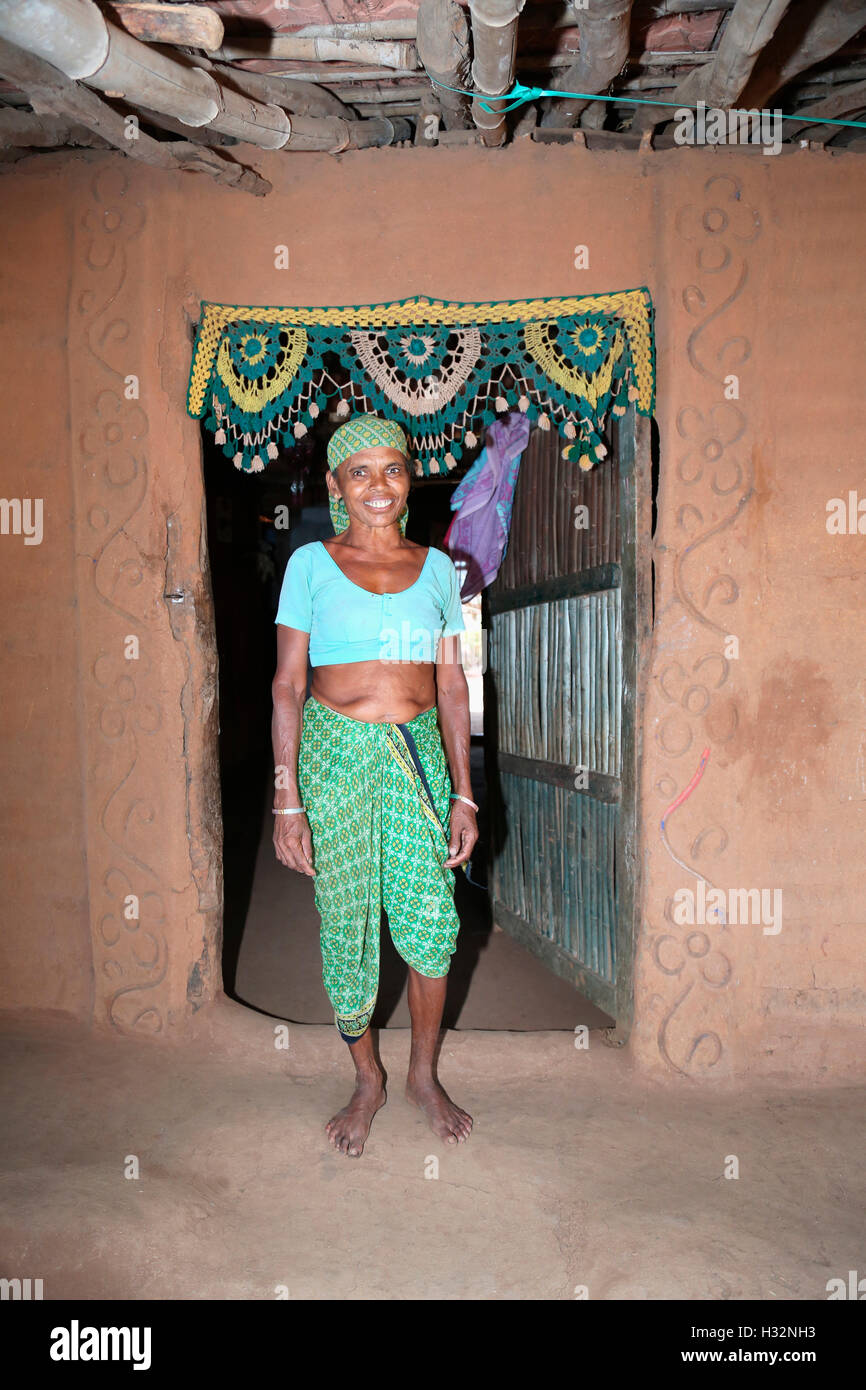 Woman standing at the entrance of her house, GAMIT TRIBE, Mandal ...