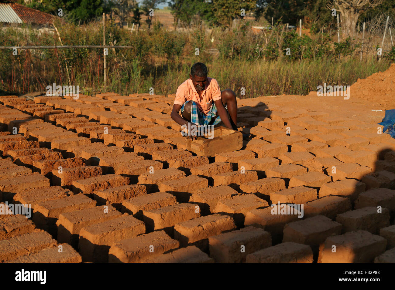 Man making mud bricks hi-res stock photography and images - Alamy