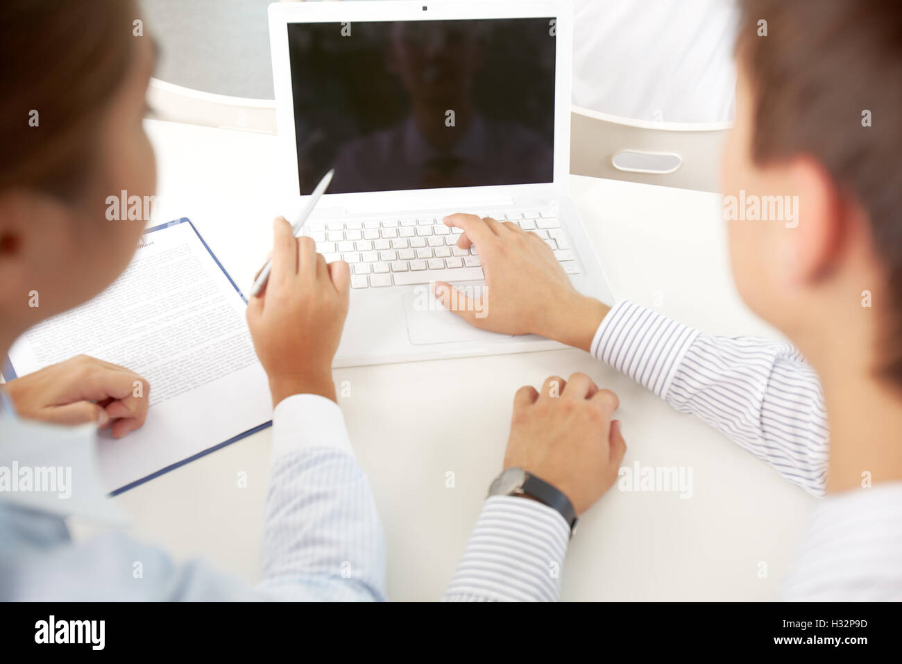 Working in pair Stock Photo - Alamy