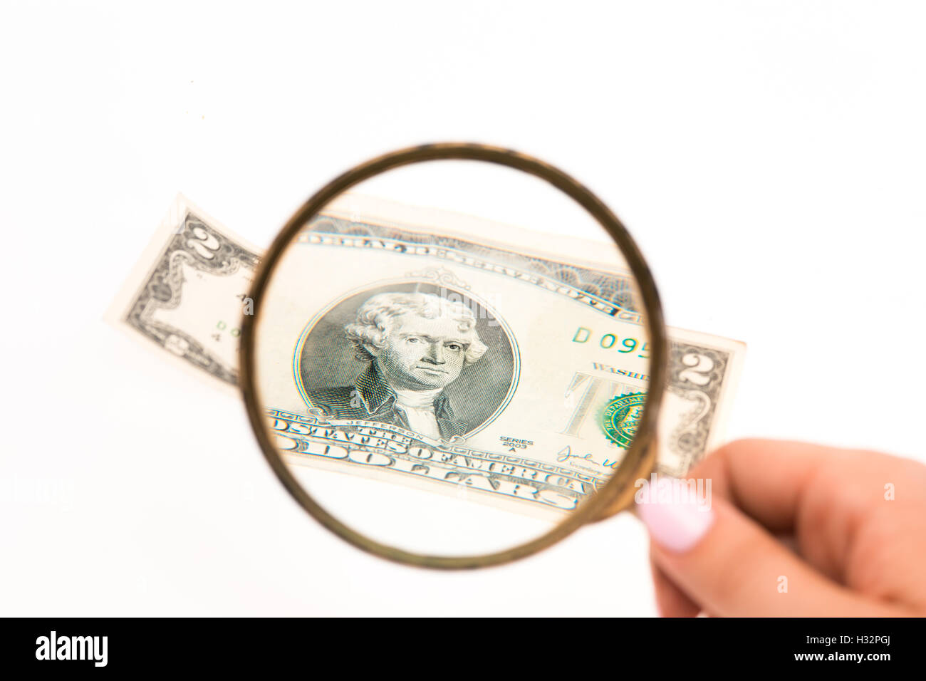 Magnifying dollar bill magnifying glass hi-res stock photography and ...