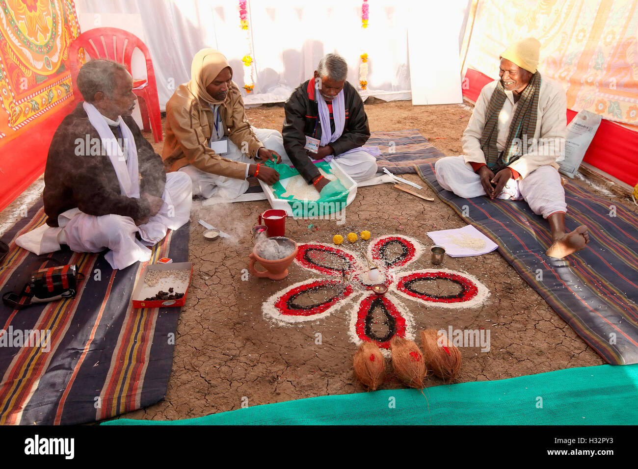 Tribal men performing Puja, Oraon Tribe, Vanvasi Kalyan Sameelan, Ujjain, Madhya Pradesh, India ...