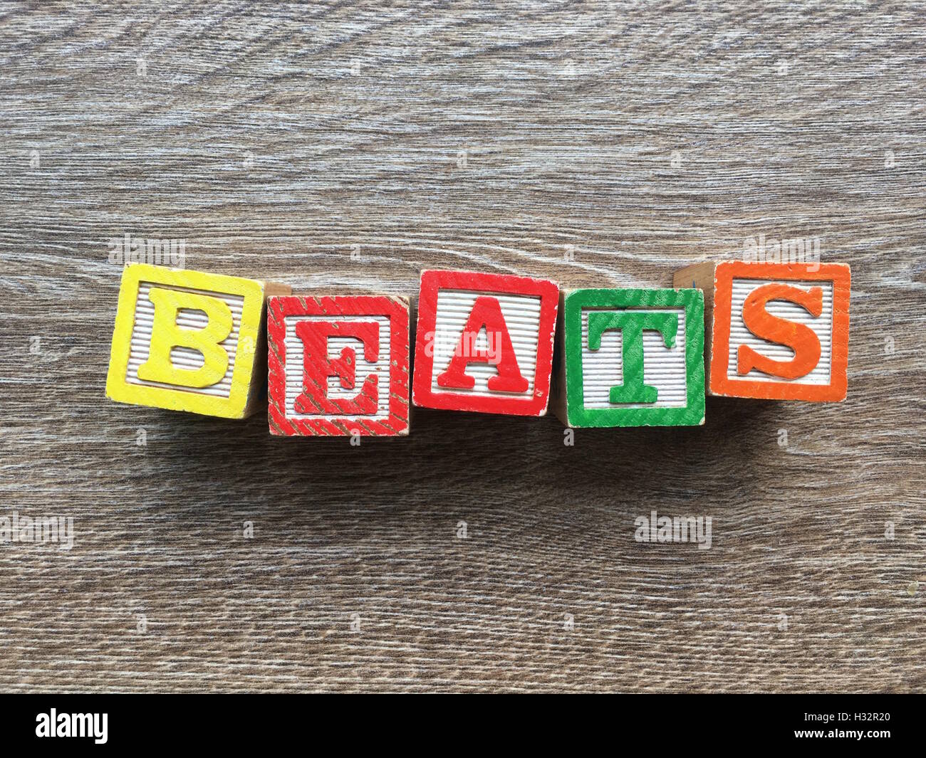 Alphabet wood block letters forming the word BEATS, it is a way for ...