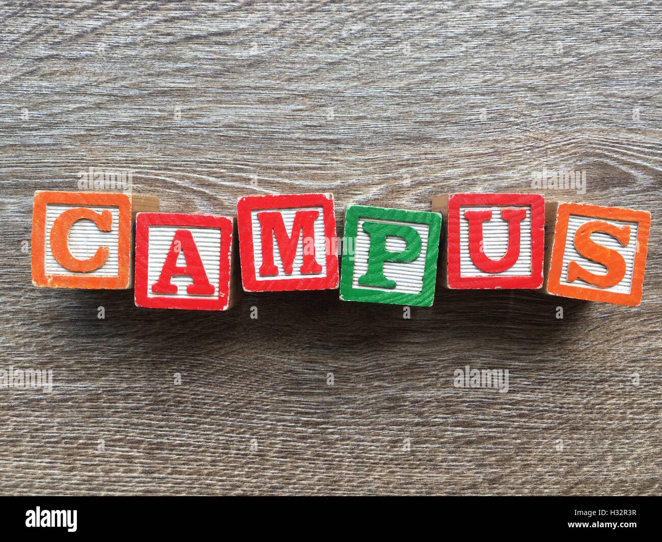 Alphabet wood block letters forming the word CAMPUS , it is a way for ...
