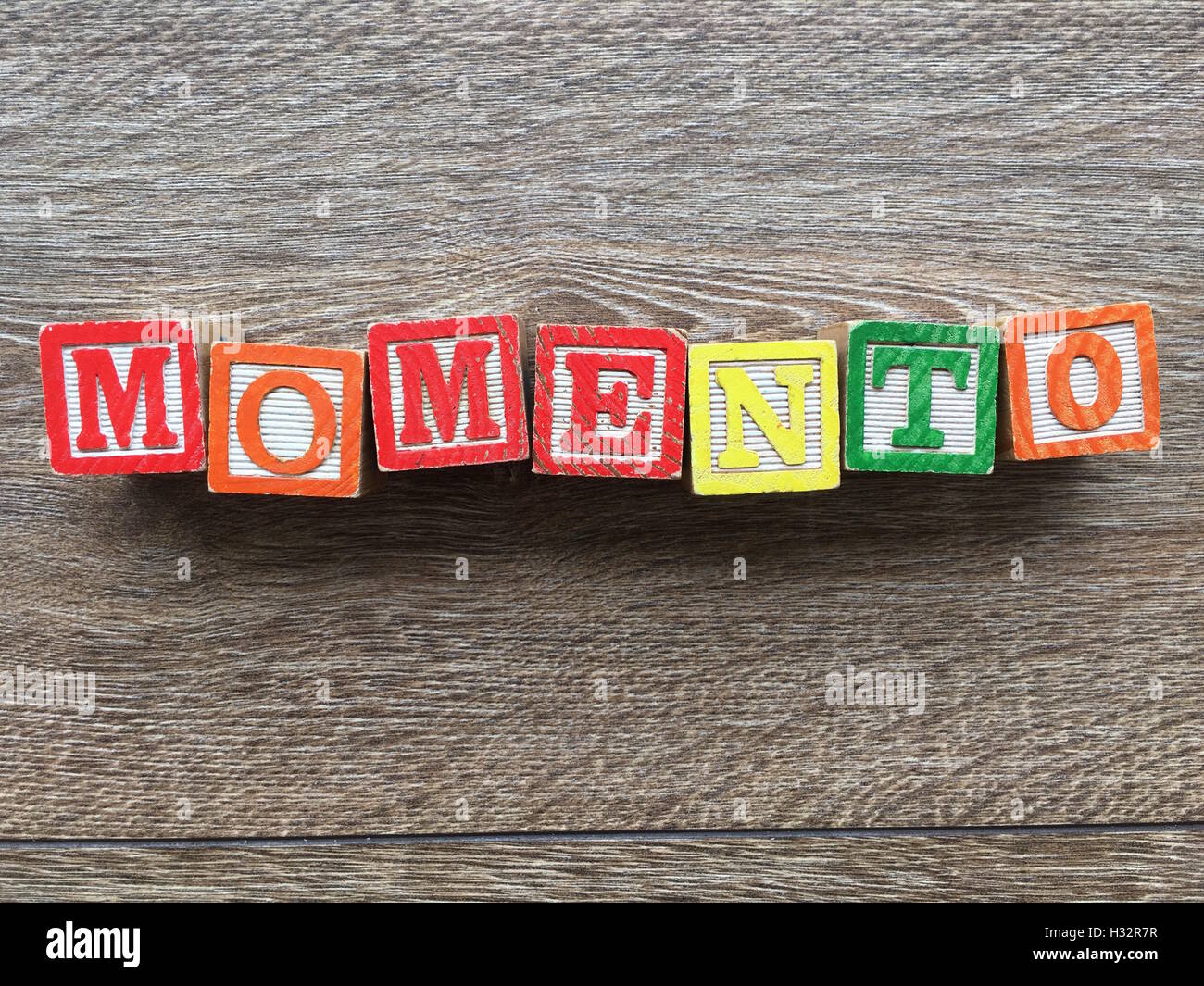 Alphabet wood block letters forming the word MOMENTO . It's a ...