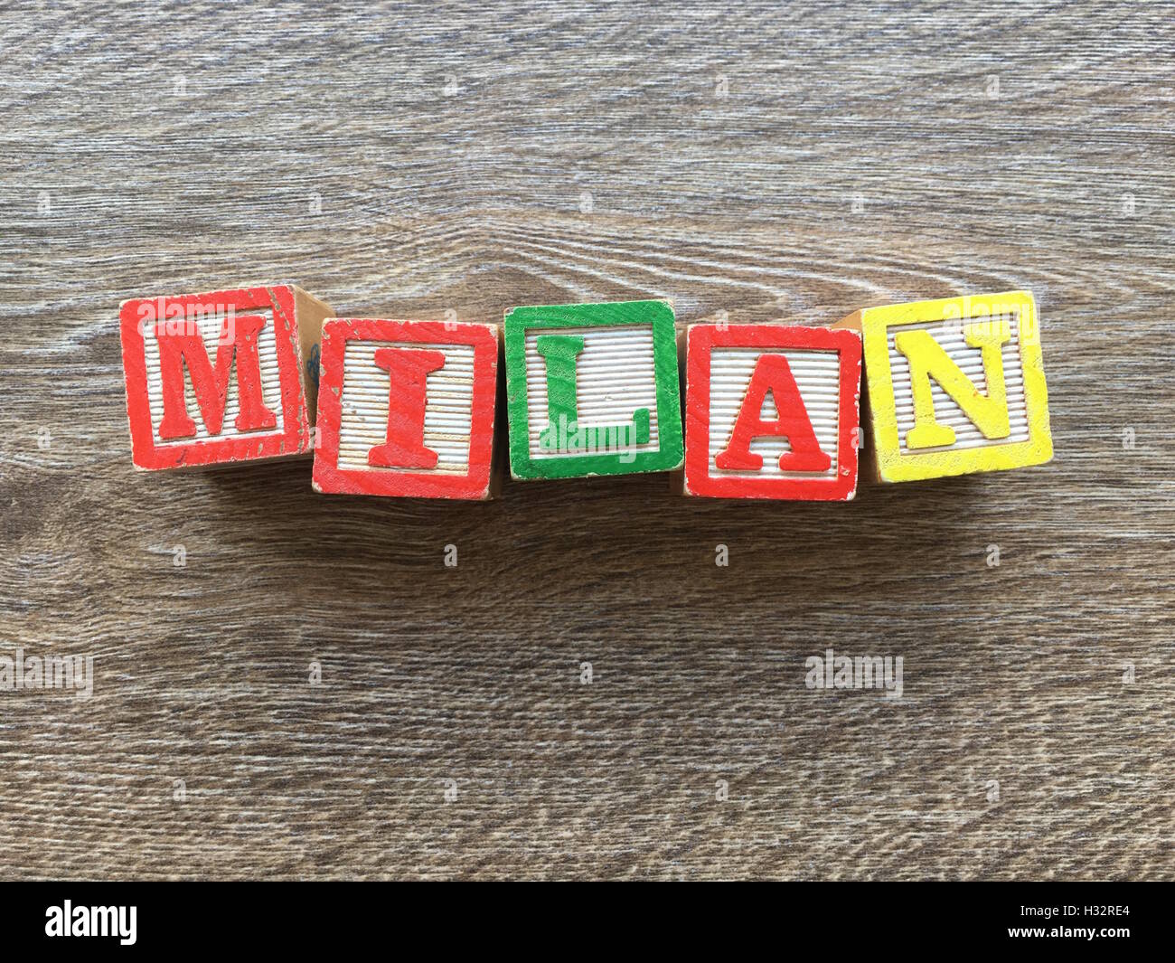 wood block alphabet letters forming a word MILAN, a city in th enorth ...