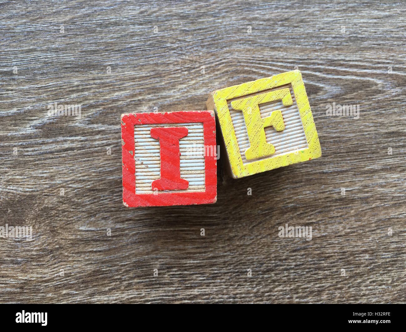 Alphabet wood blocks making the word IF Stock Photo - Alamy