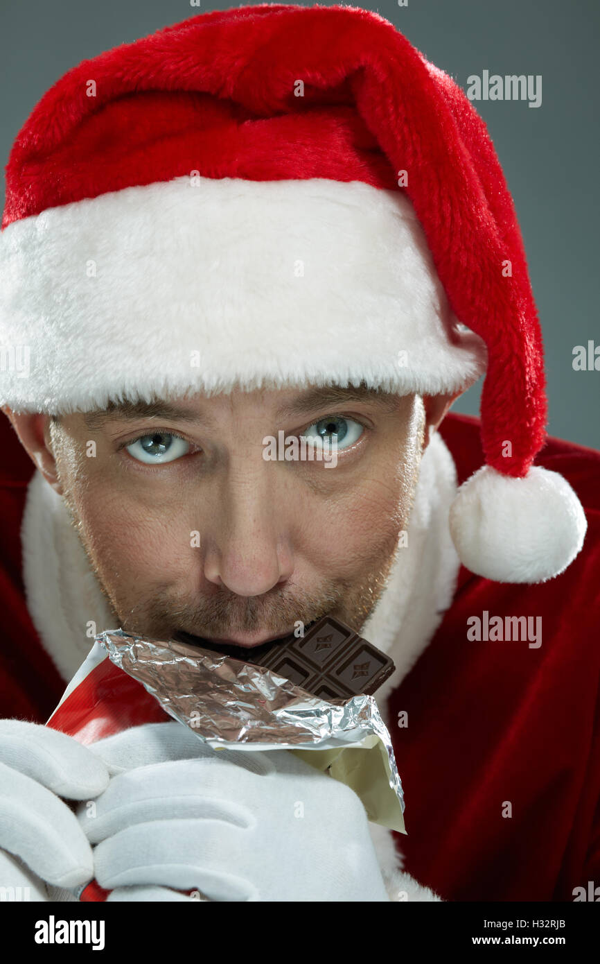 Santa with sweet tooth Stock Photo - Alamy