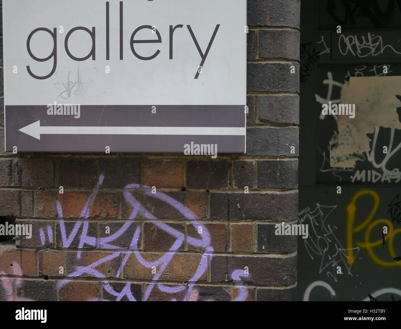 Sign for 'Gallery' and urban, graffiti wall Stock Photo - Alamy