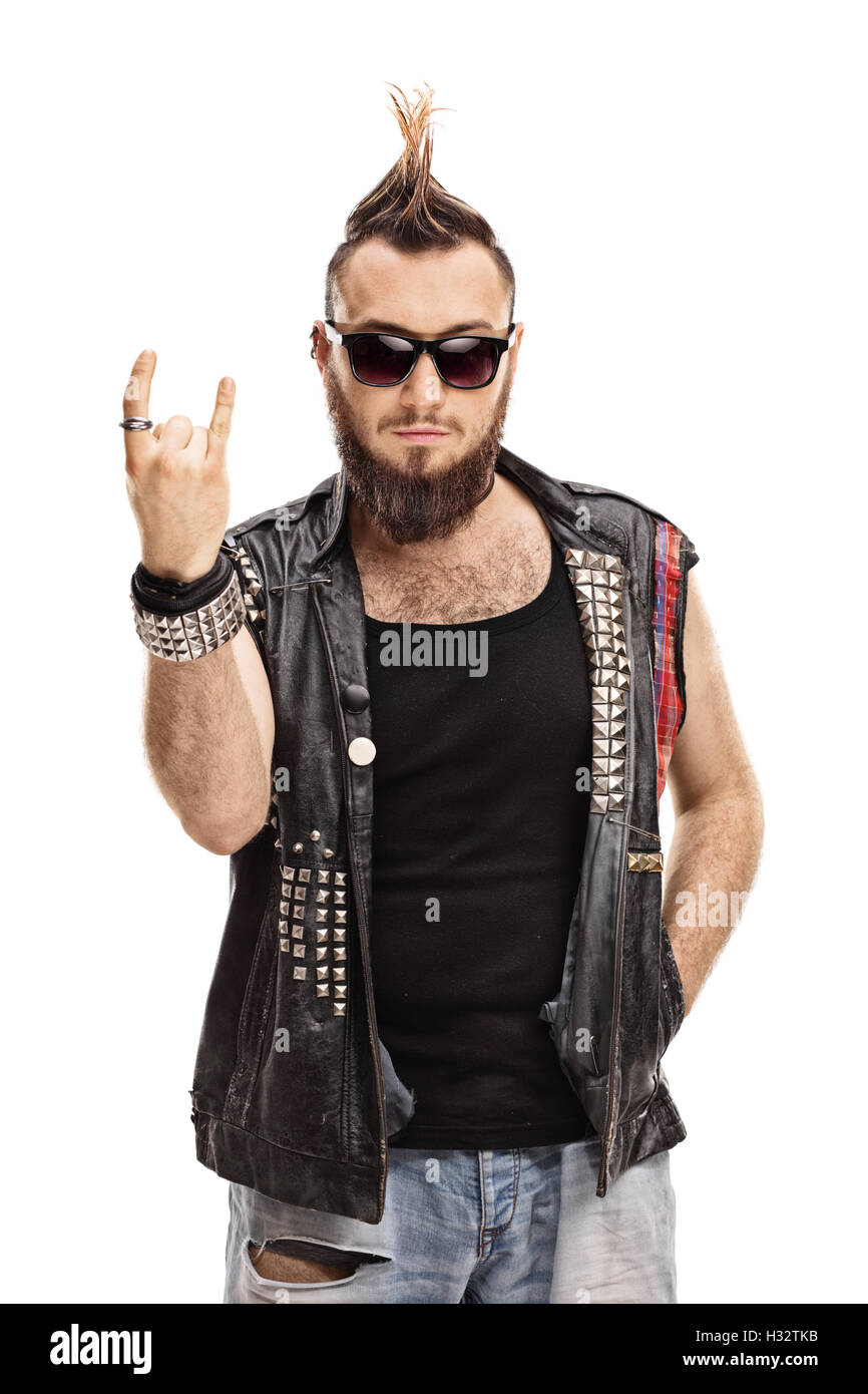 Young punker doing a rock hand gesture isolated on white background ...